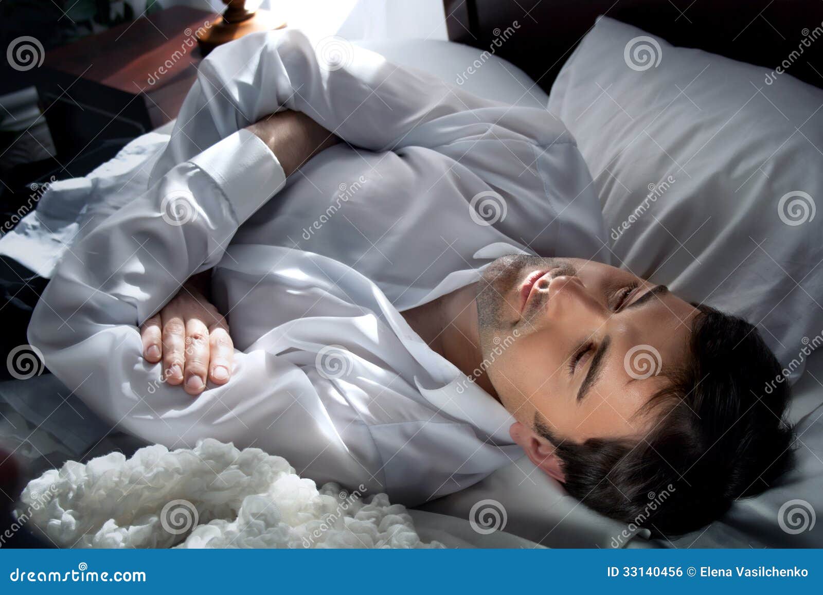 Handsome Man Relaxing and Dreaming on Bed Stock Photo - Image of ...