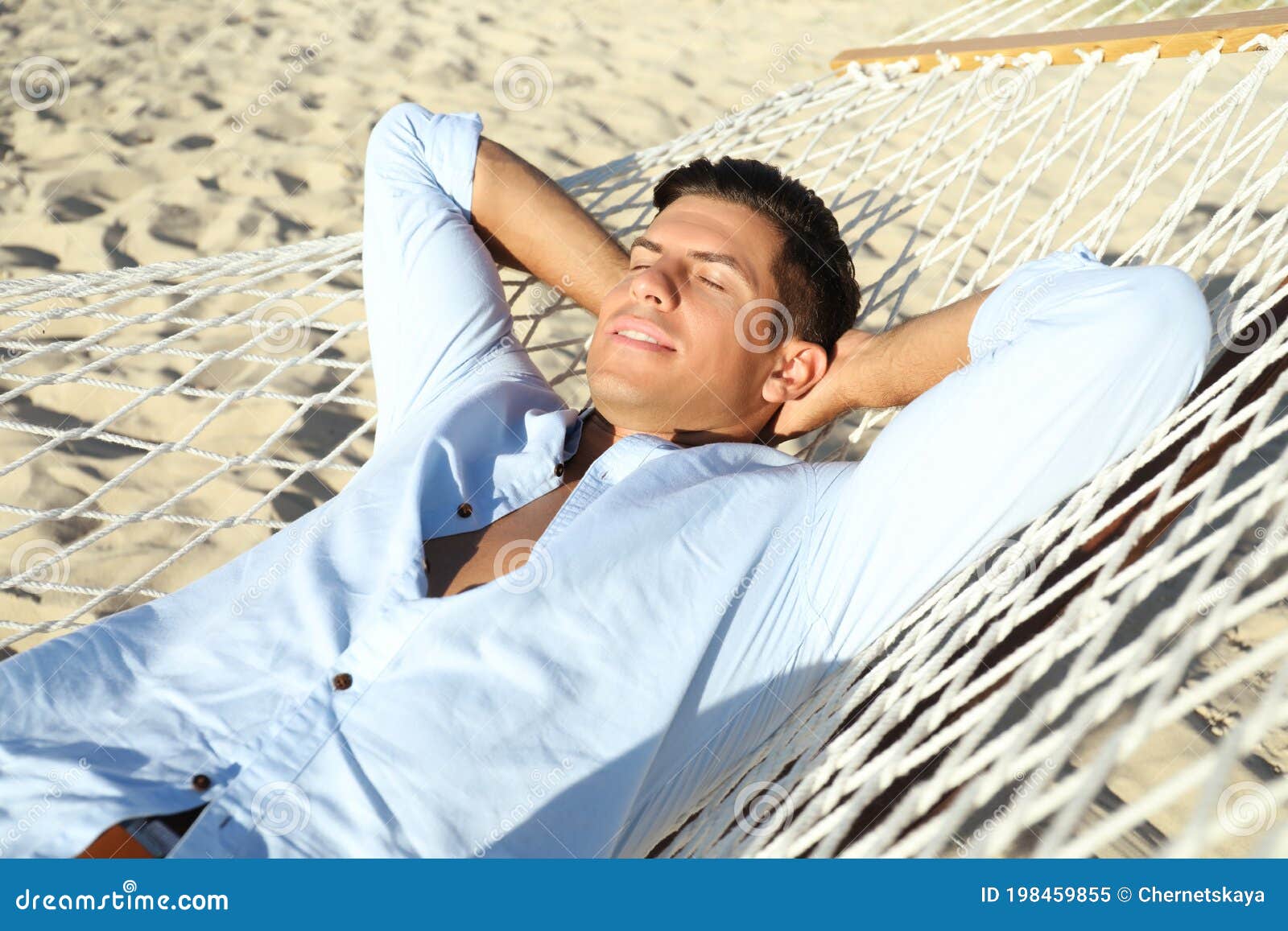 Handsome Man Relaxing in Hammock on Beach Stock Image - Image of lounge ...