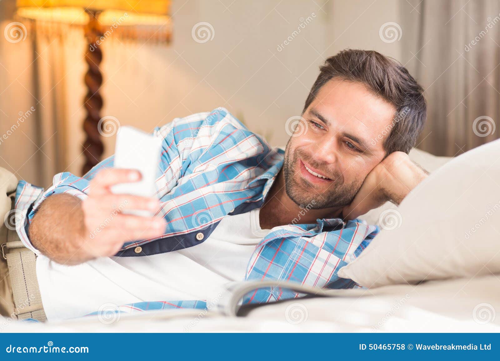Handsome Man Relaxing on His Bed Stock Photo - Image of indoors, male ...