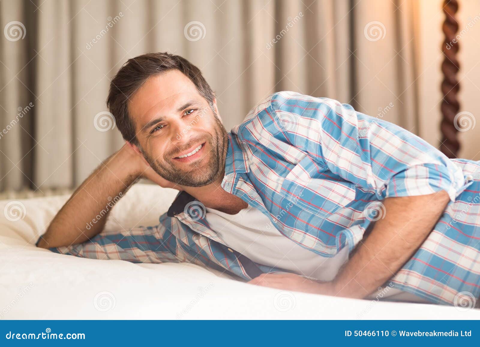 Handsome Man Relaxing on His Bed Stock Photo - Image of male, bedroom ...