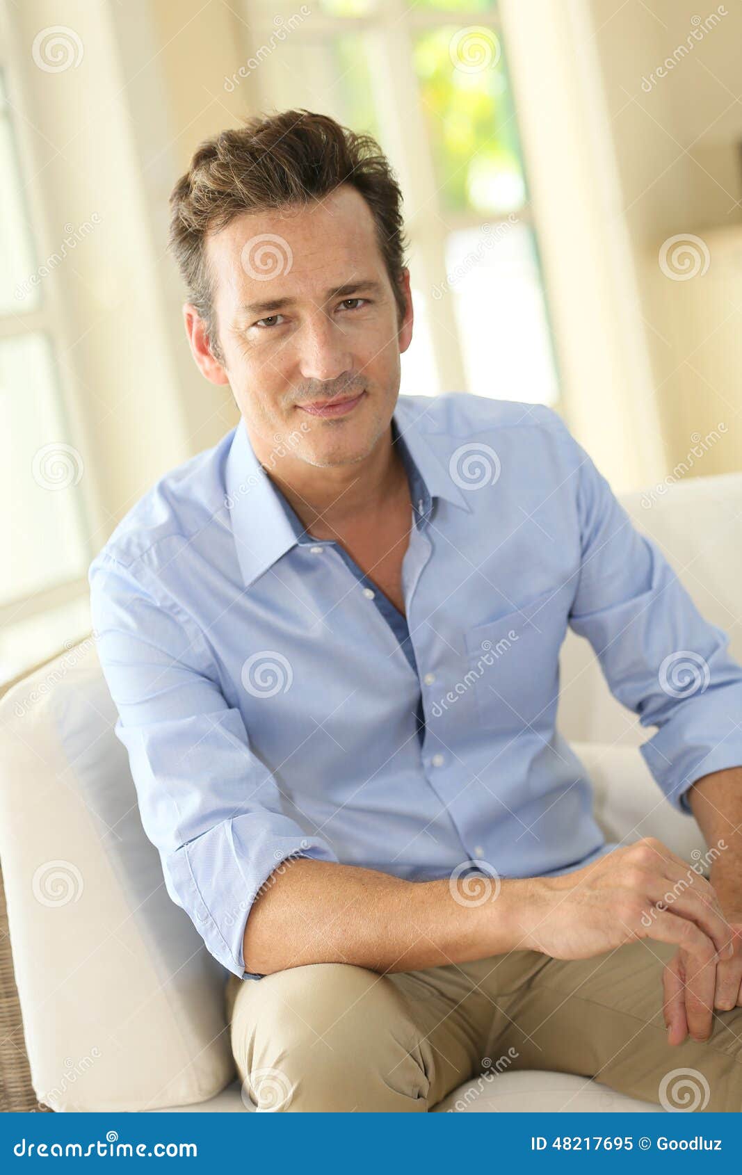 Handsome Man Relaxing on a Sofa Stock Image - Image of handsome, aged ...