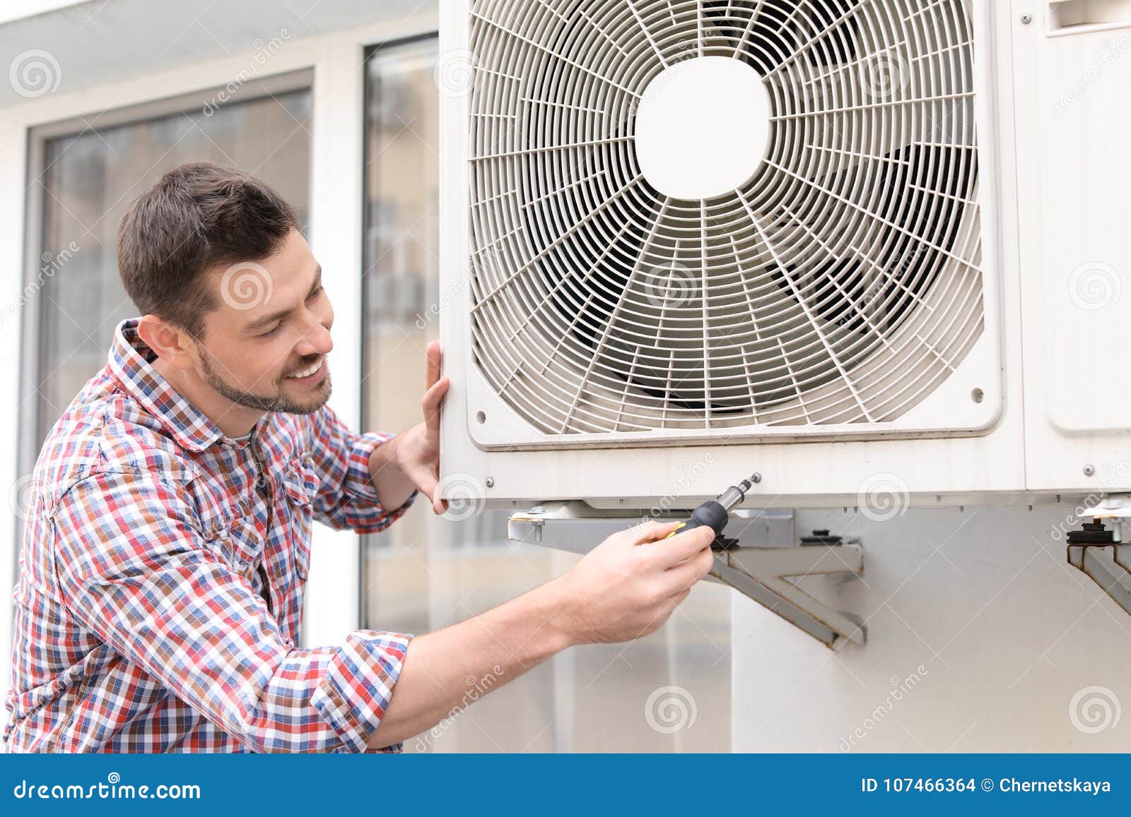 Handsome Man Repairing Air Conditioner Stock Photo - Image of hygiene ...