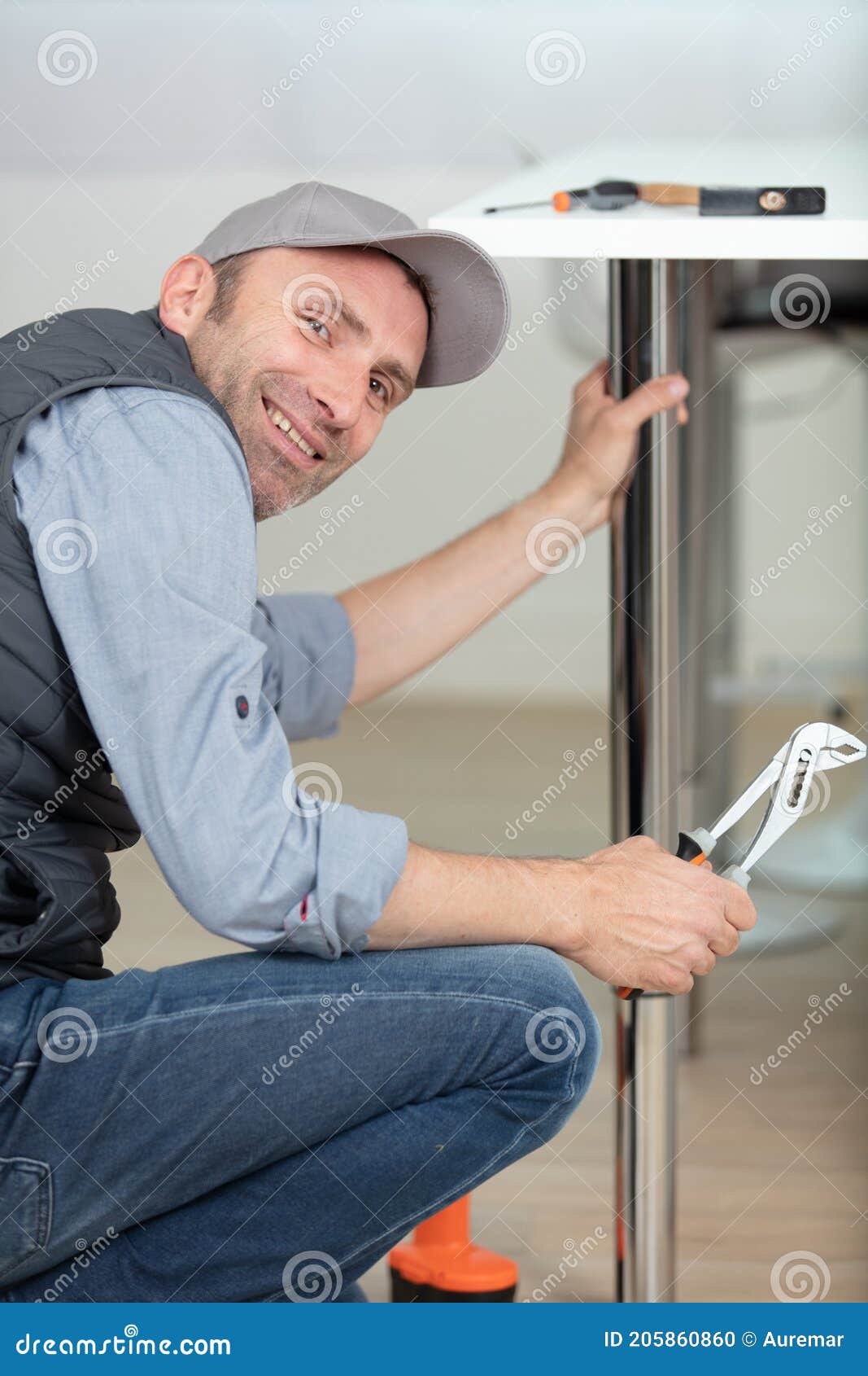 Handsome Man Repairing Table with Tools Stock Photo - Image of ...
