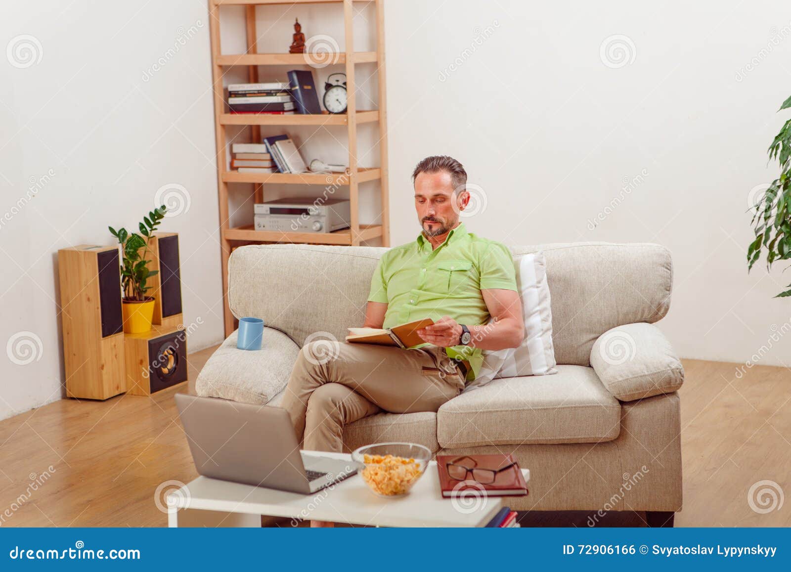 Handsome Man Resting on Sofa at Home Stock Photo - Image of lying, male ...