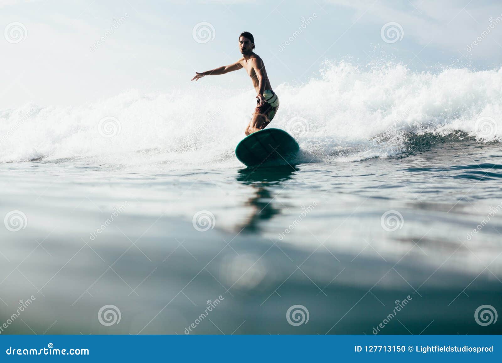 Handsome Man Riding Waves on Surfboard while Stock Photo - Image of ...