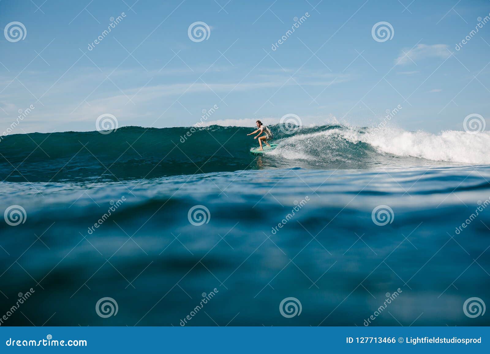 Handsome Man Riding Waves on Surfboard while Stock Photo - Image of ...