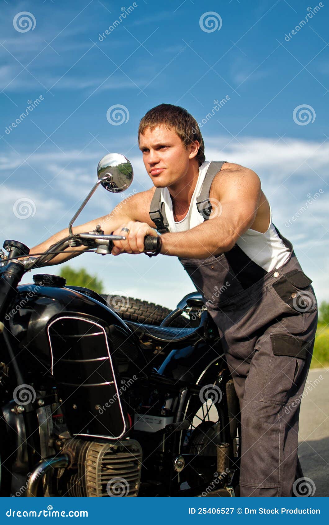 Handsome Man Rolling a Motorcycle. Stock Image - Image of highway ...