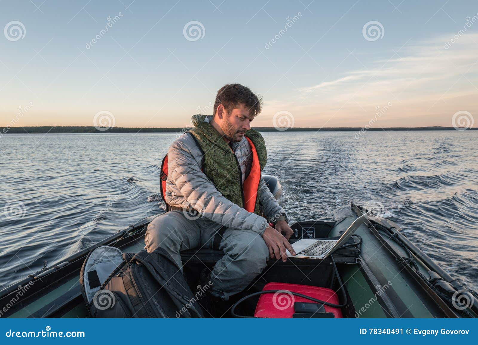 Handsome Man is Seating in the Boat and Working with Laptop Stock Image ...