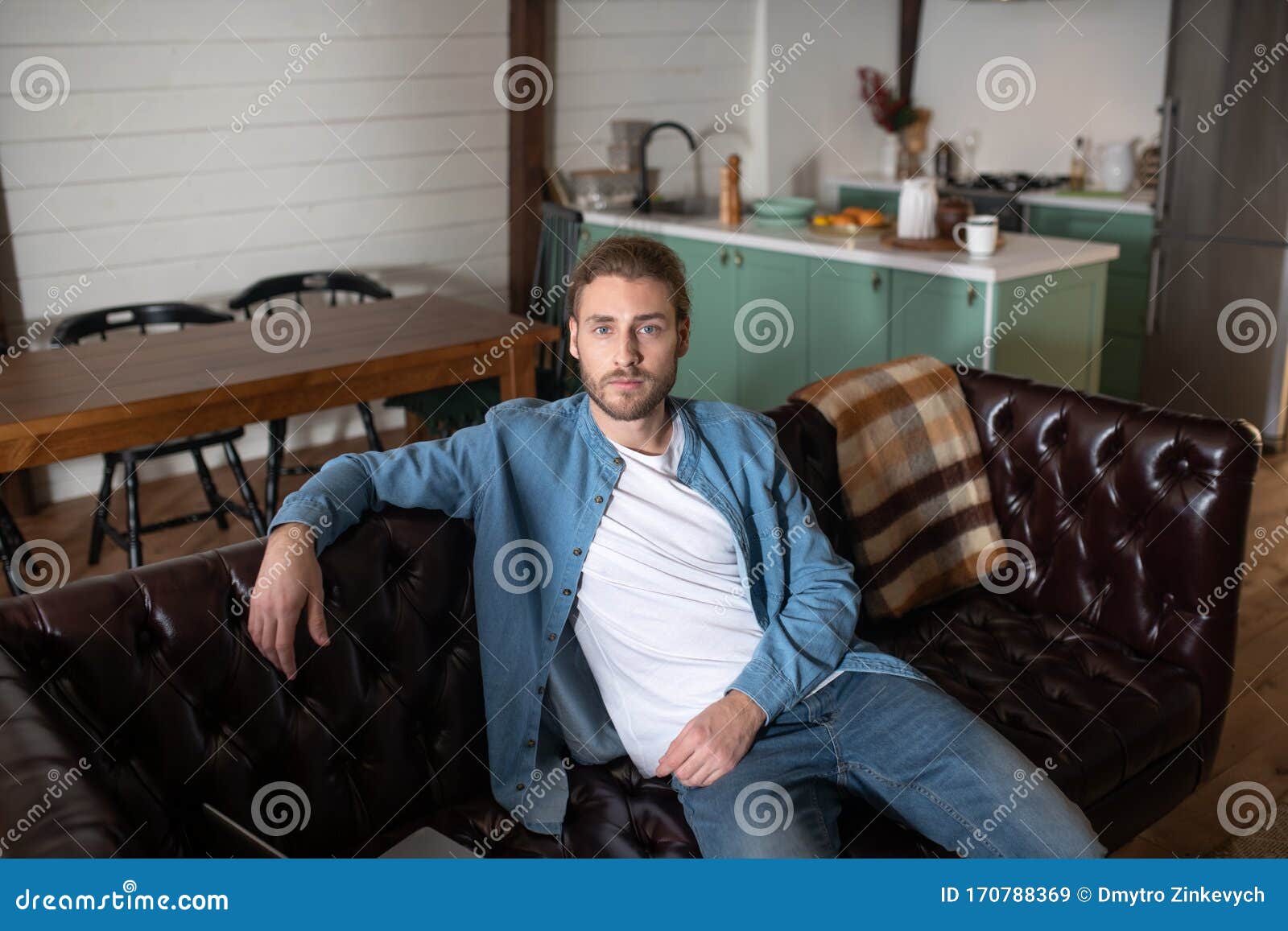 Handsome Man Seating on the Leather Sofa Stock Image - Image of leather ...