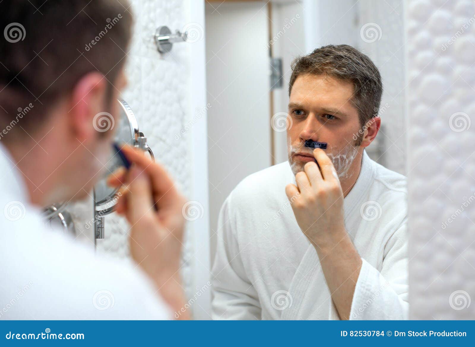 Handsome man shaving. stock photo. Image of bathrobe - 82530784