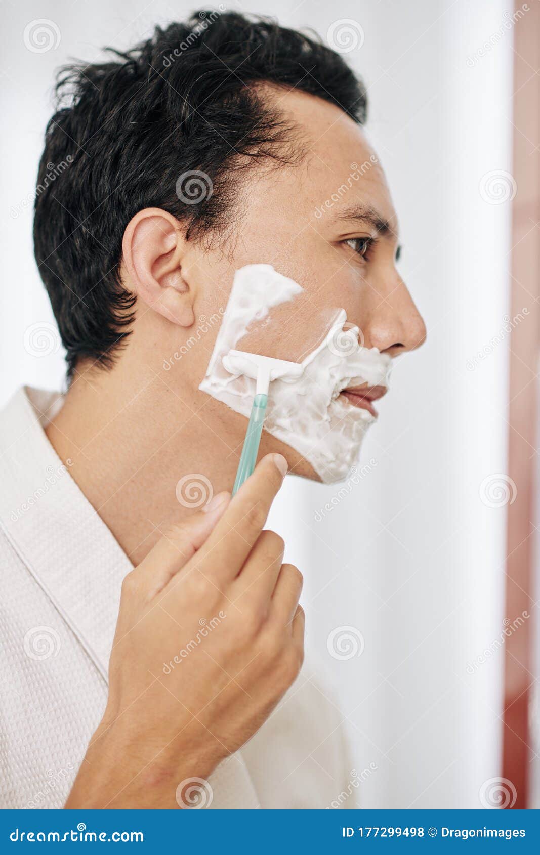 Handsome man shaving stock photo. Image of domestic - 177299498