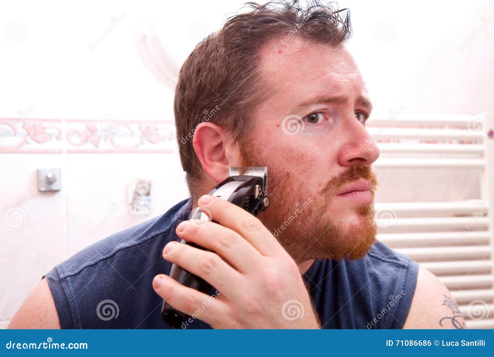 Handsome Man Shaving Face with Electric Razor Stock Photo - Image of ...