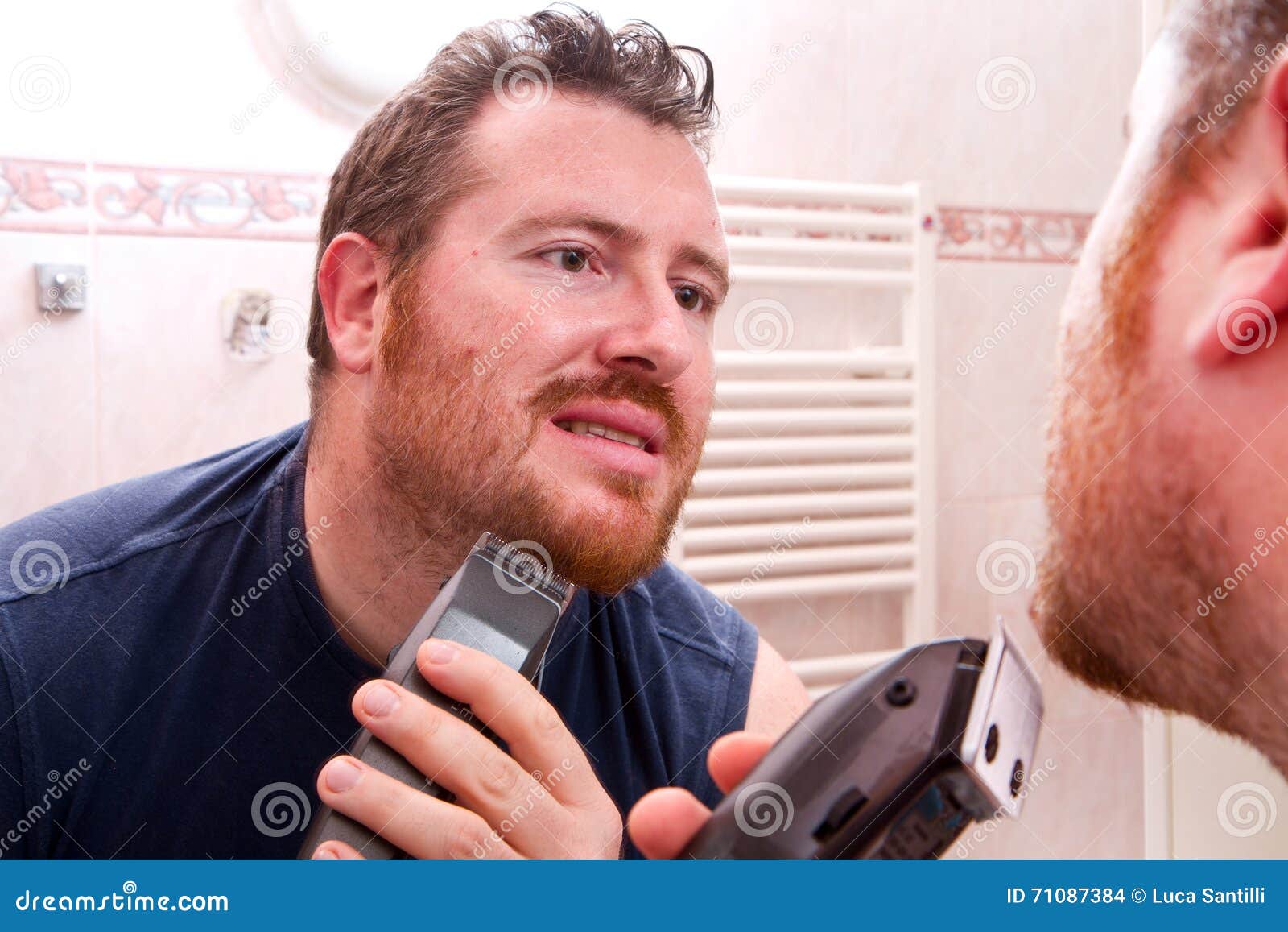 Handsome Man Shaving Face with Electric Razor Stock Photo - Image of ...