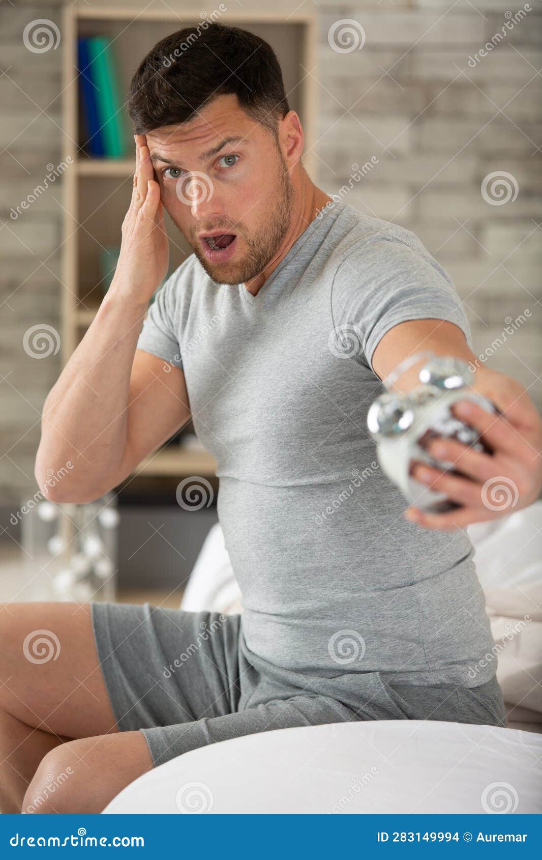 Handsome Man Shocked As he Wakes Up Late Stock Photo - Image of hour ...