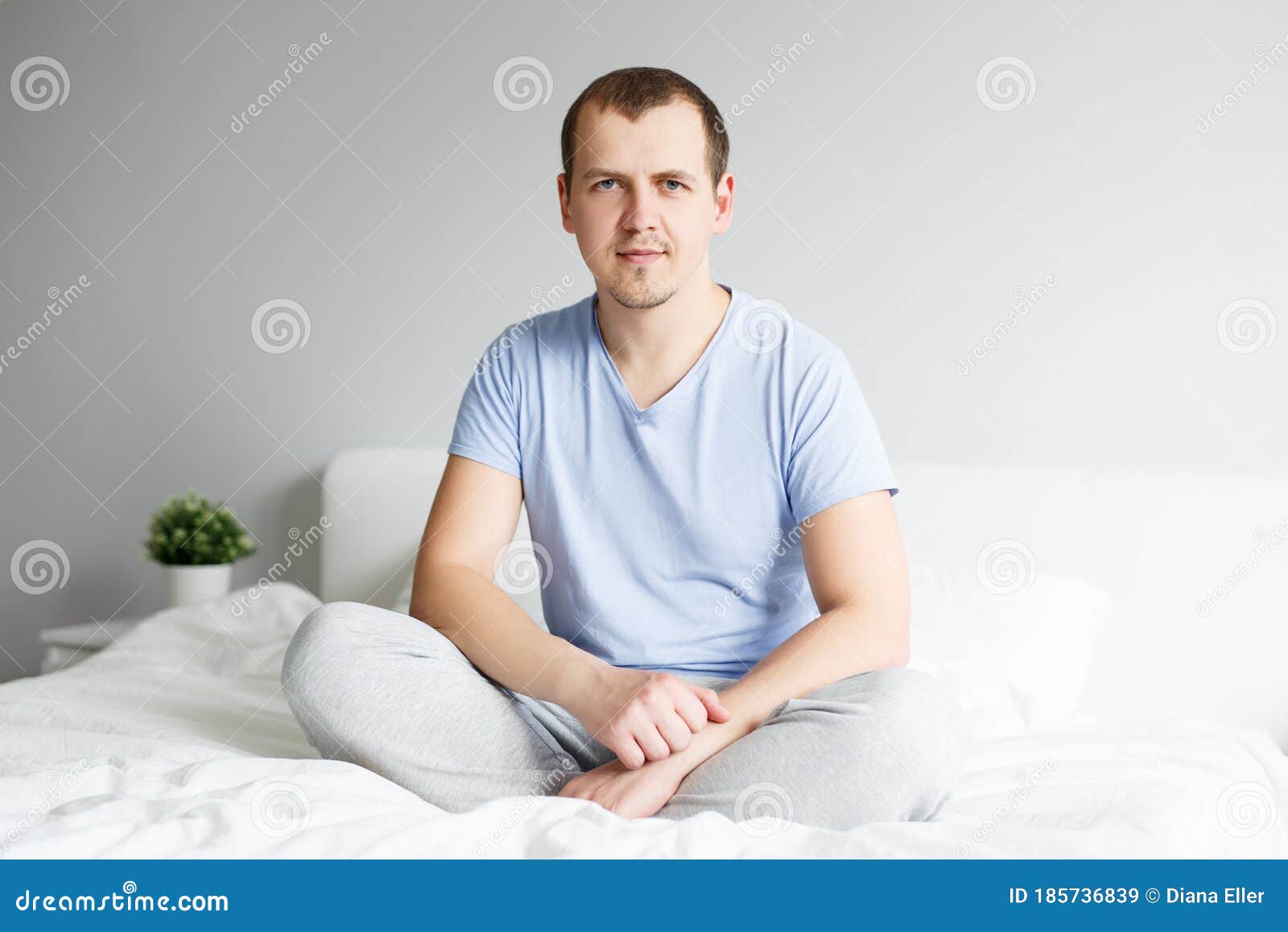 Handsome Man Sitting on Bed at Home Stock Image - Image of bedroom ...