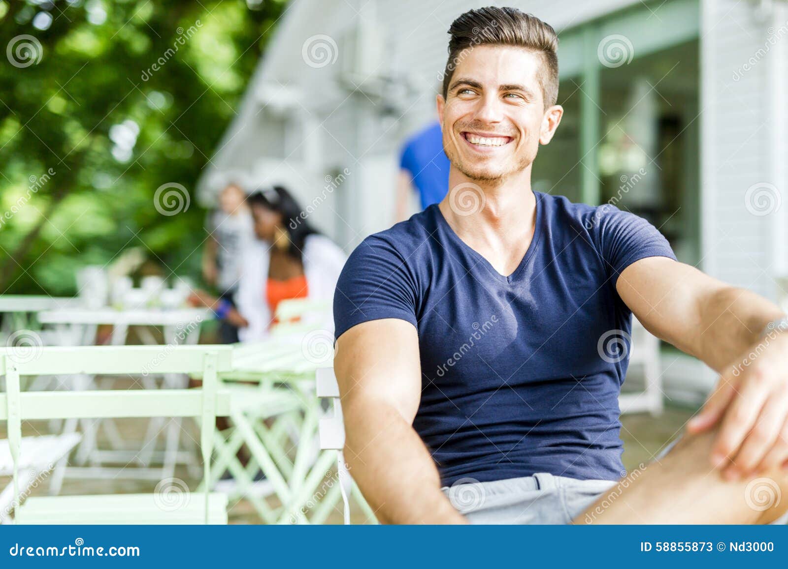 Handsome Man Sitting on a Chair and a Smiling Stock Image - Image of ...