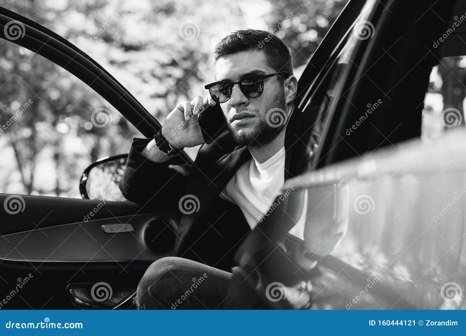 Handsome Man Sitting in Limousine, Talking on Cellphone. Stock Image ...