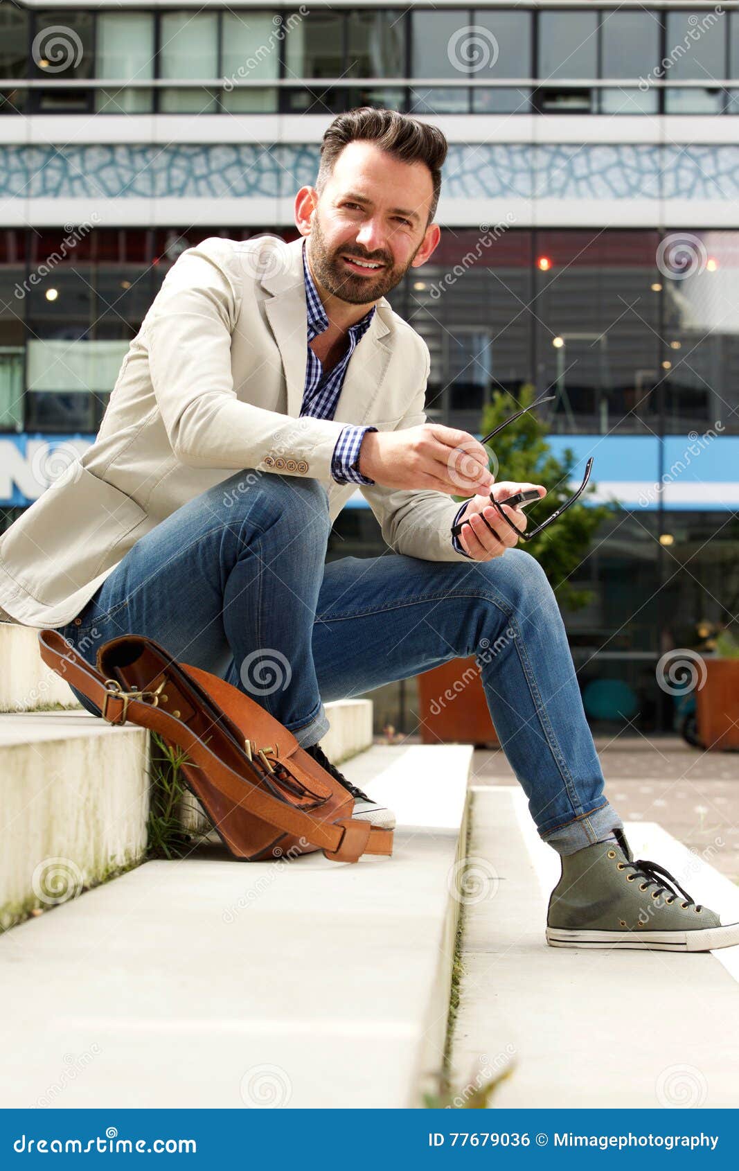 Handsome Man Sitting Outdoors on Steps Stock Photo - Image of phone ...