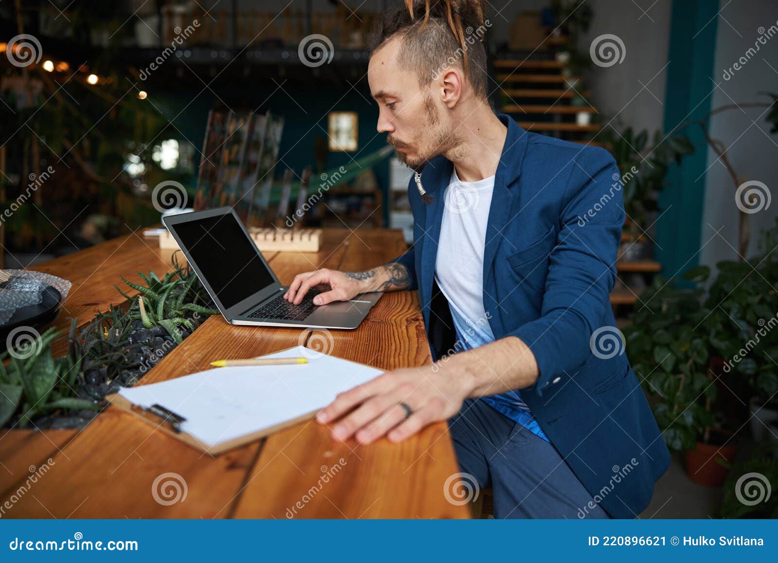 Stylish Young Man Using Modern Laptop at Work Stock Image - Image of ...