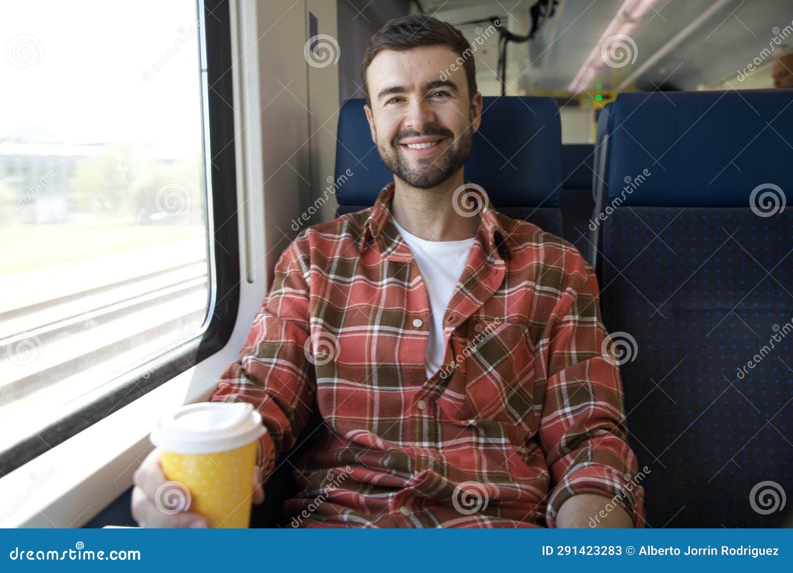 Handsome Man Sitting on Train with Coffee Cup Stock Image - Image of ...