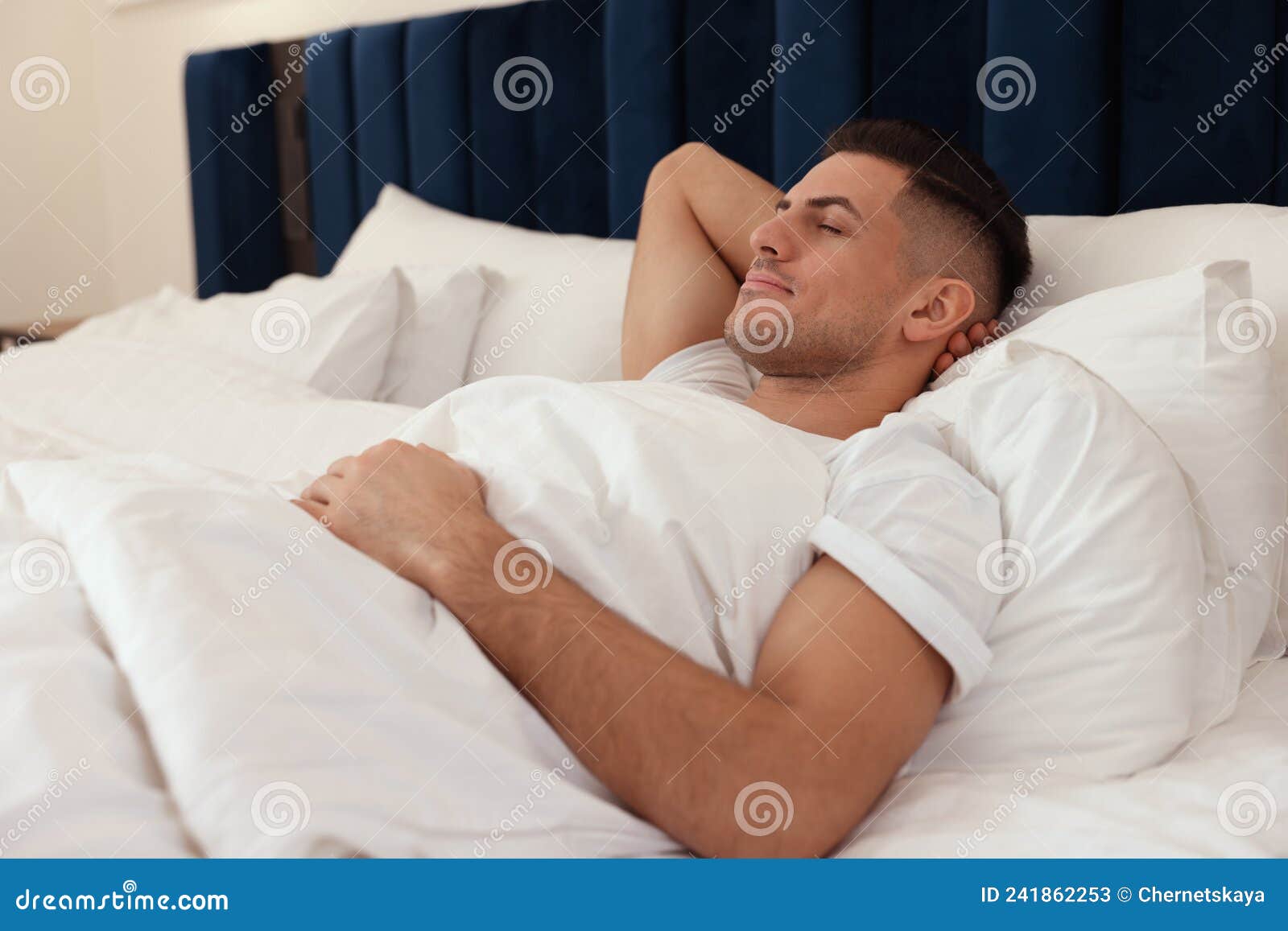 Handsome Man Sleeping in Comfortable Hotel Bed Stock Image - Image of ...