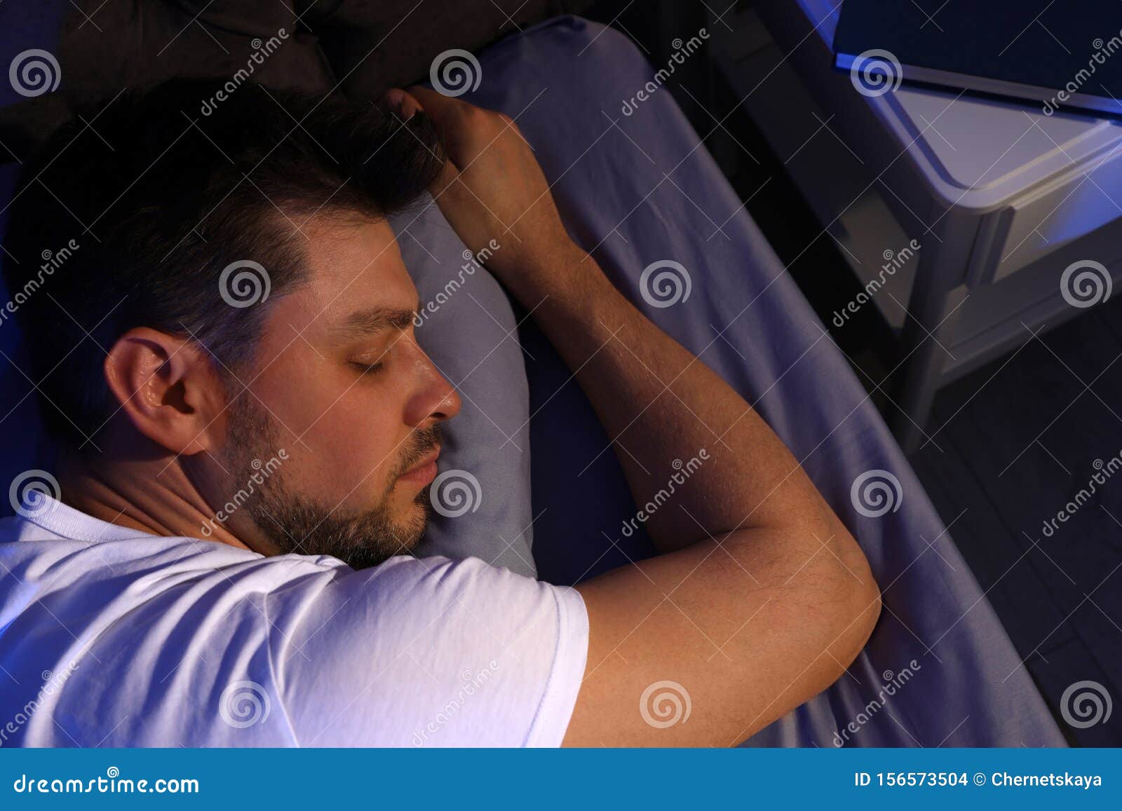 Handsome Man Sleeping on Pillow in Dark Room at Night, View from Above ...