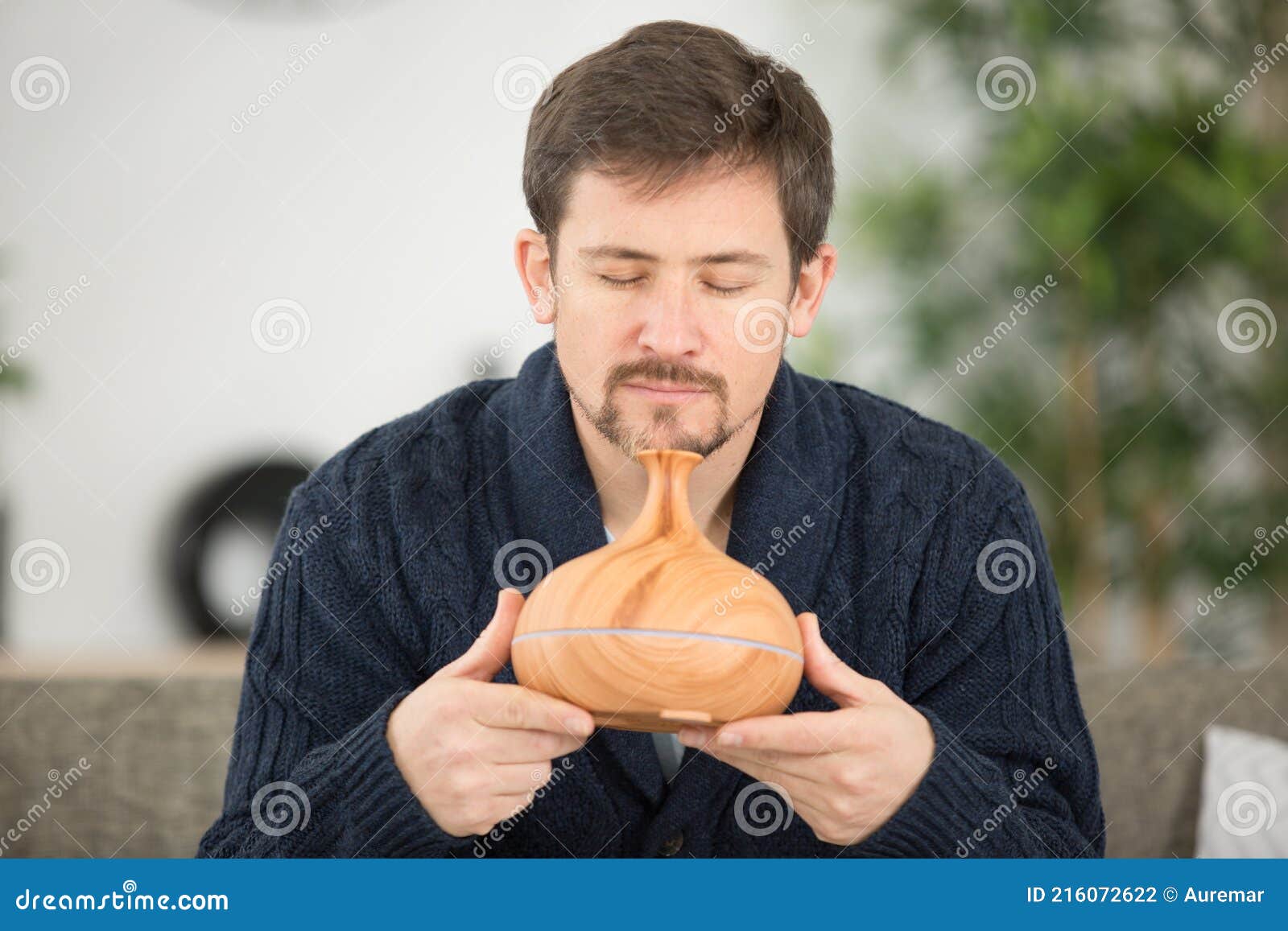 Handsome Man Smelling Aroma from Essential Oil Diffuser Stock Photo ...