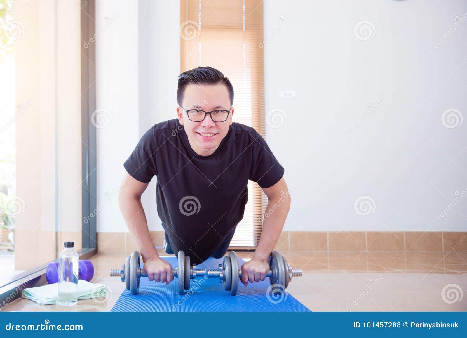 Handsome Man Smiles while Exercising at Home Stock Photo - Image of ...