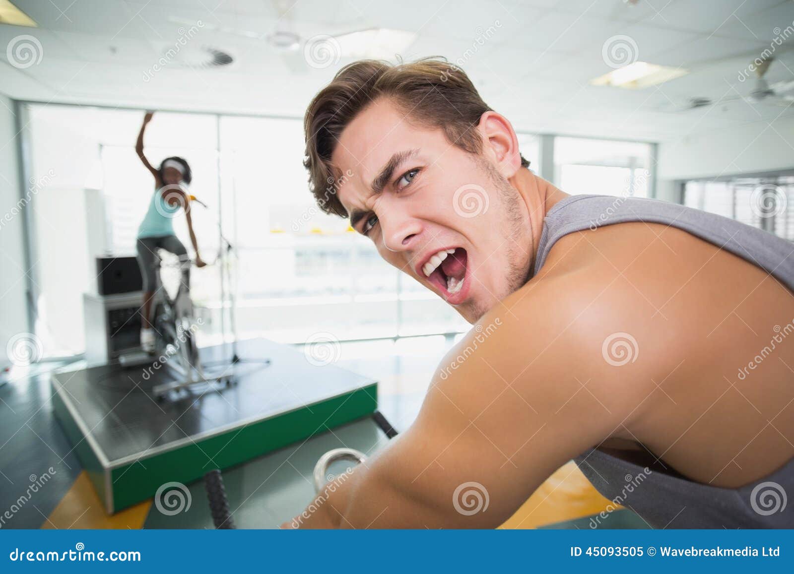 Handsome Man Smiling at Camera in Spin Class Stock Image - Image of ...
