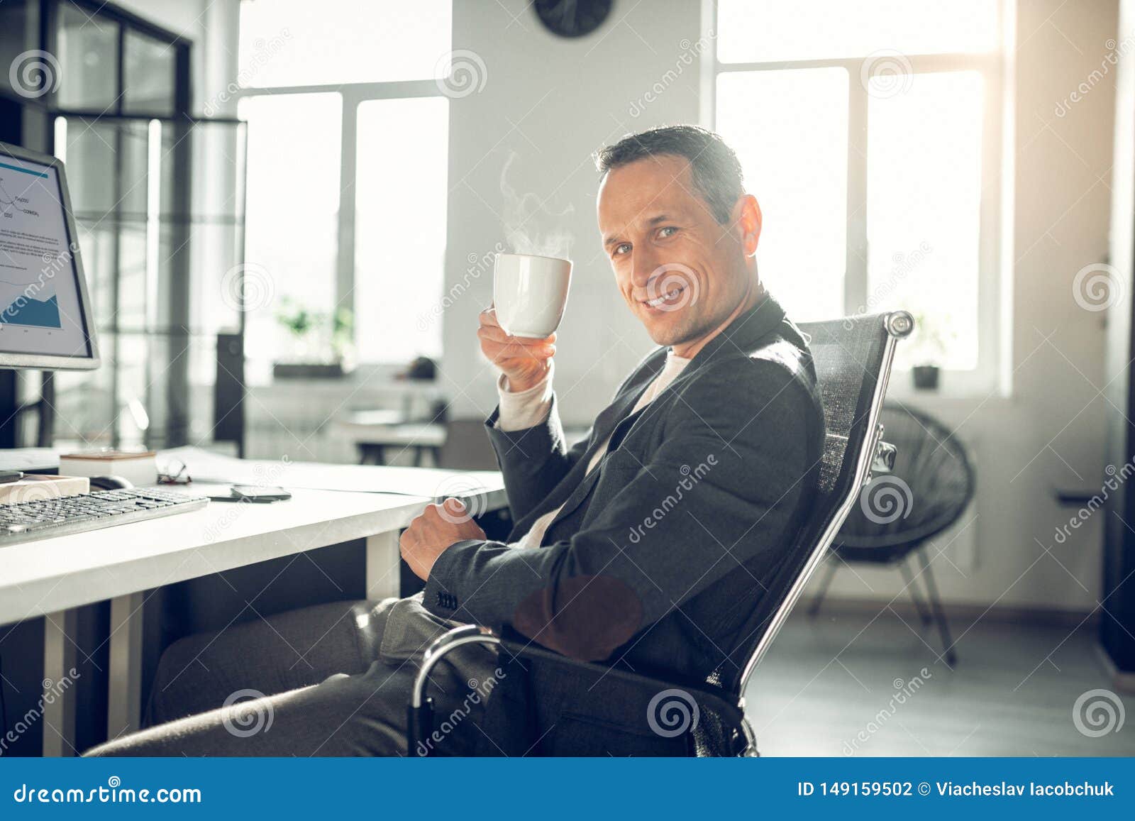 Handsome Man Smiling while Drinking Good Coffee in the Office Stock ...