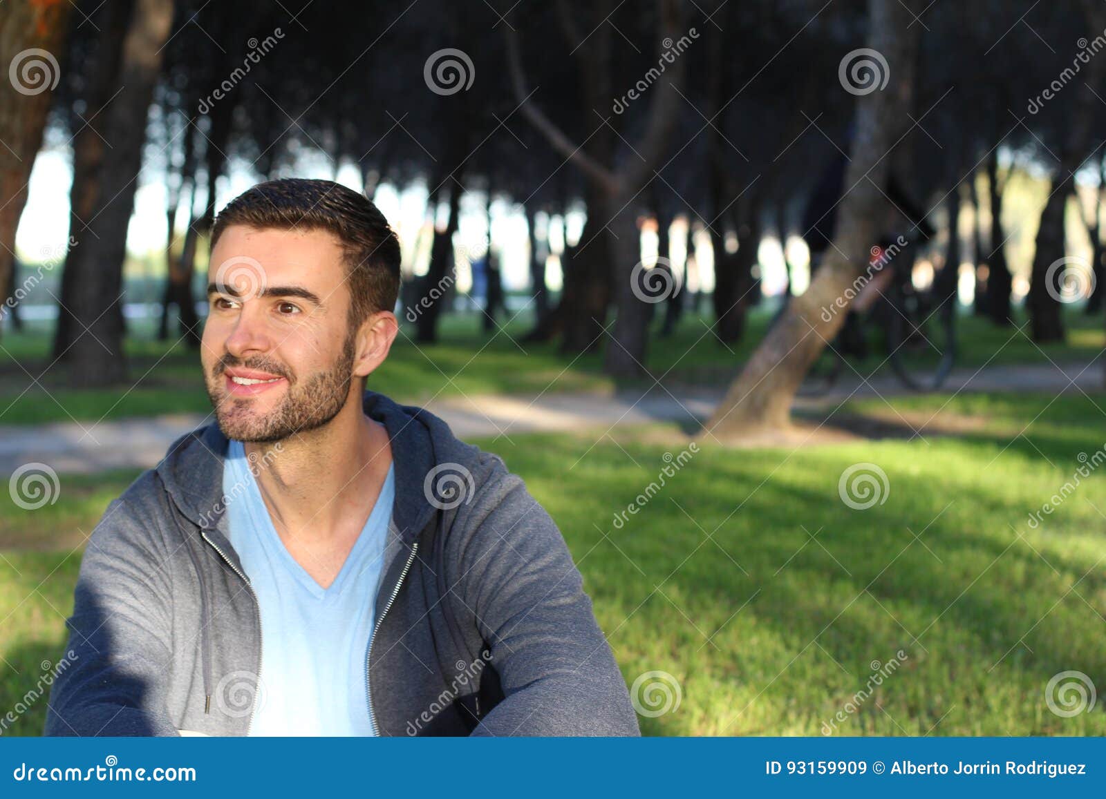 Handsome Man Smiling in the Park while Looking at the Sunset or Sunrise ...