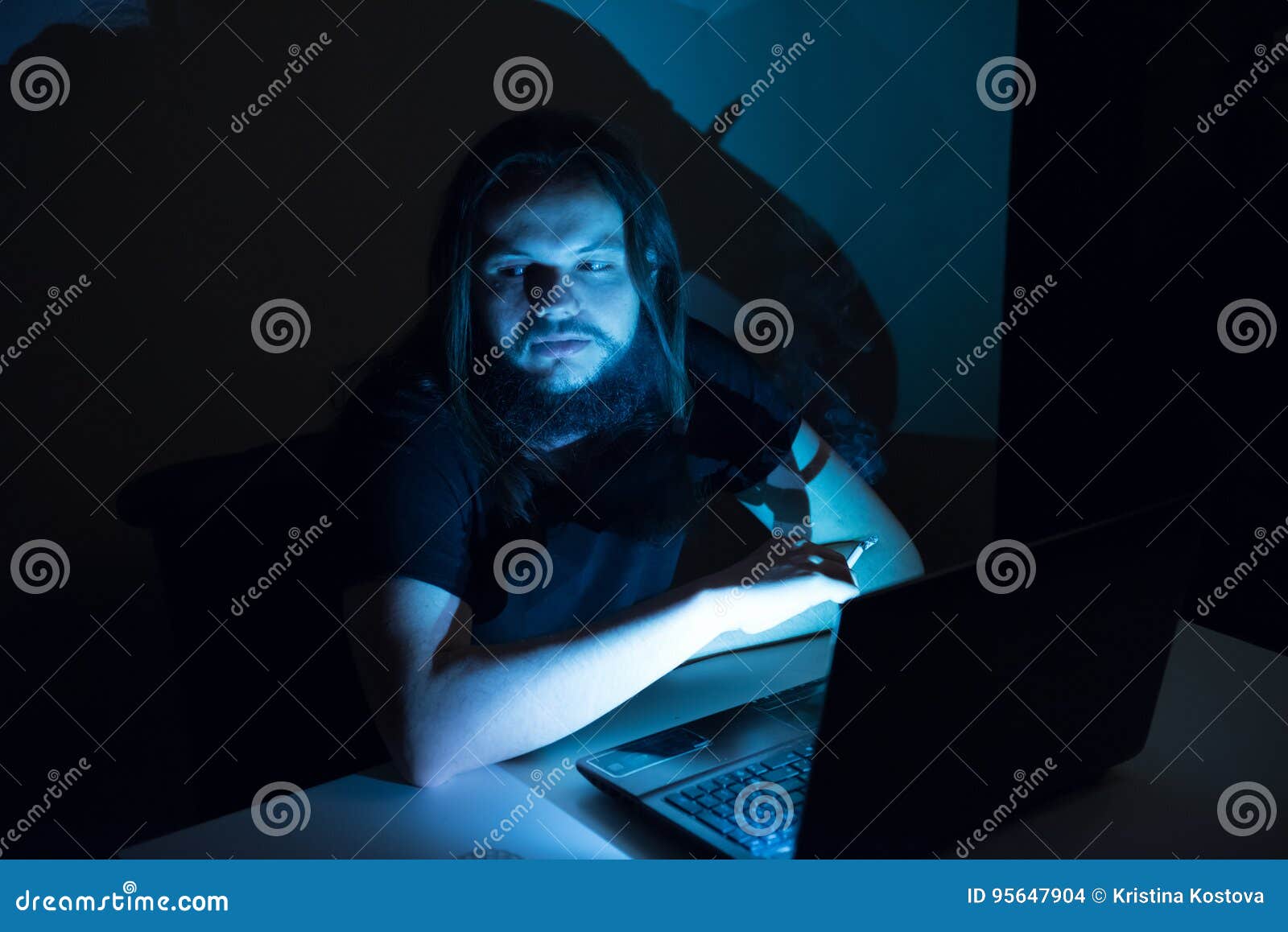 Handsome Man is Smocking Cigarettes in Front of His Computer Stock ...
