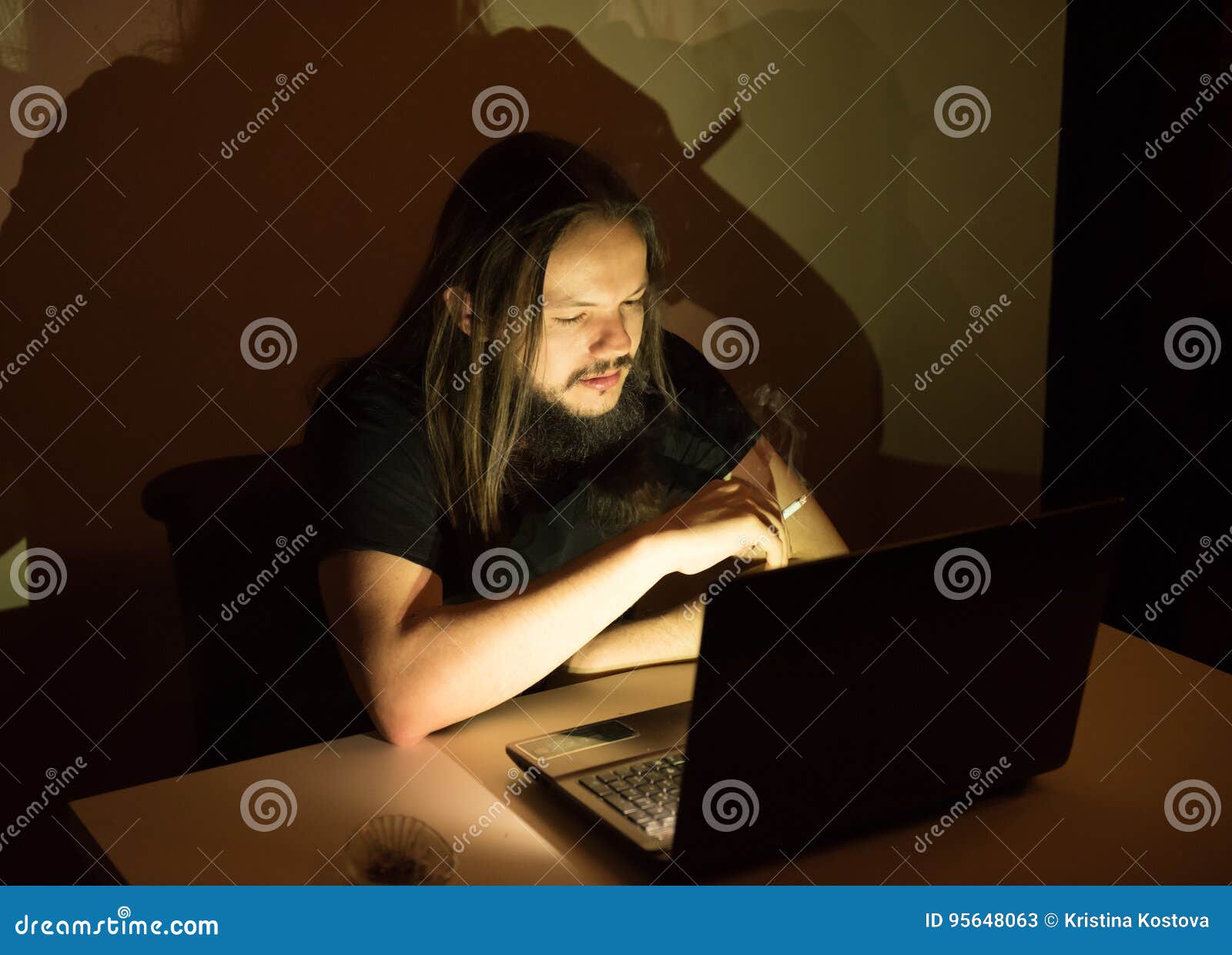 Handsome Man is Smocking Cigarettes in Front of His Computer Stock ...
