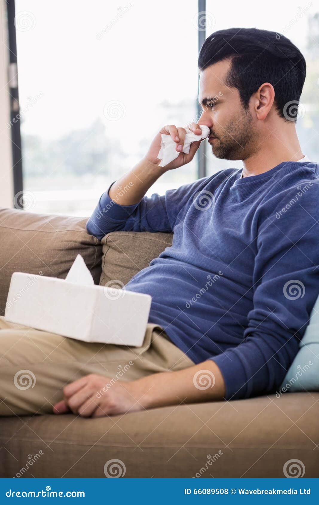 Handsome man sneezing stock photo. Image of room, apartment - 66089508