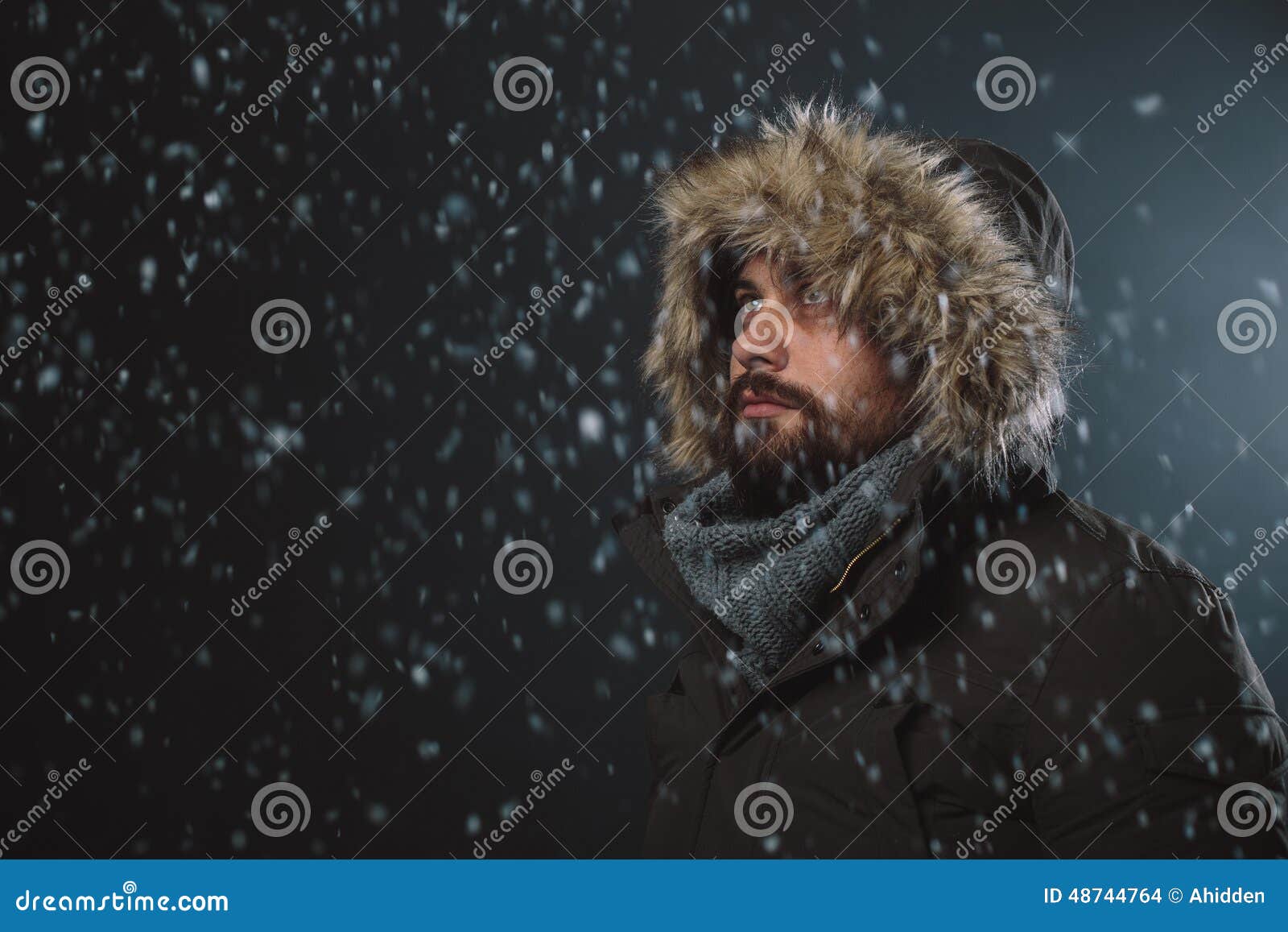 Handsome man in snow storm stock photo. Image of blue - 48744764