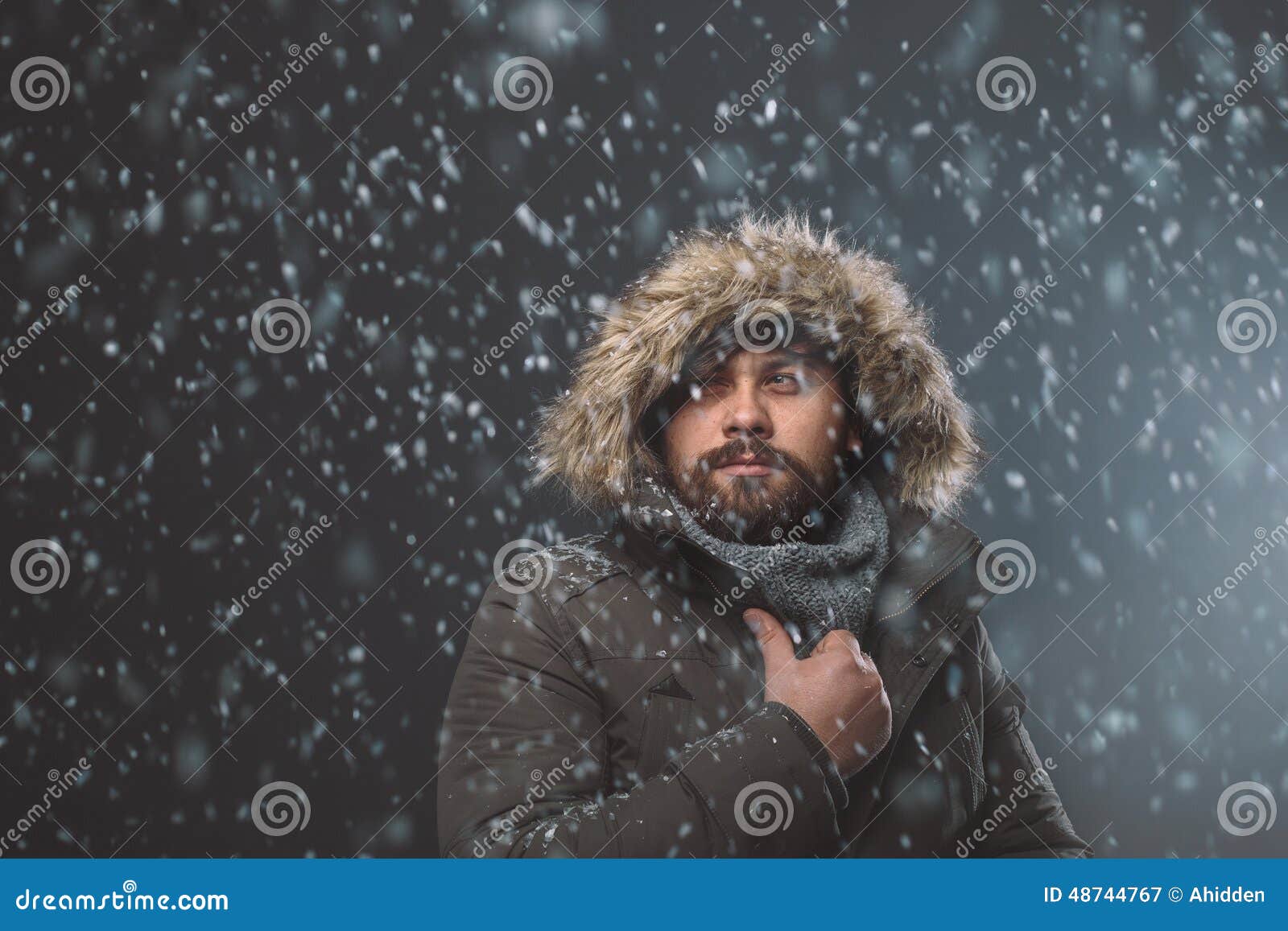 Handsome man in snow storm stock image. Image of portrait - 48744767