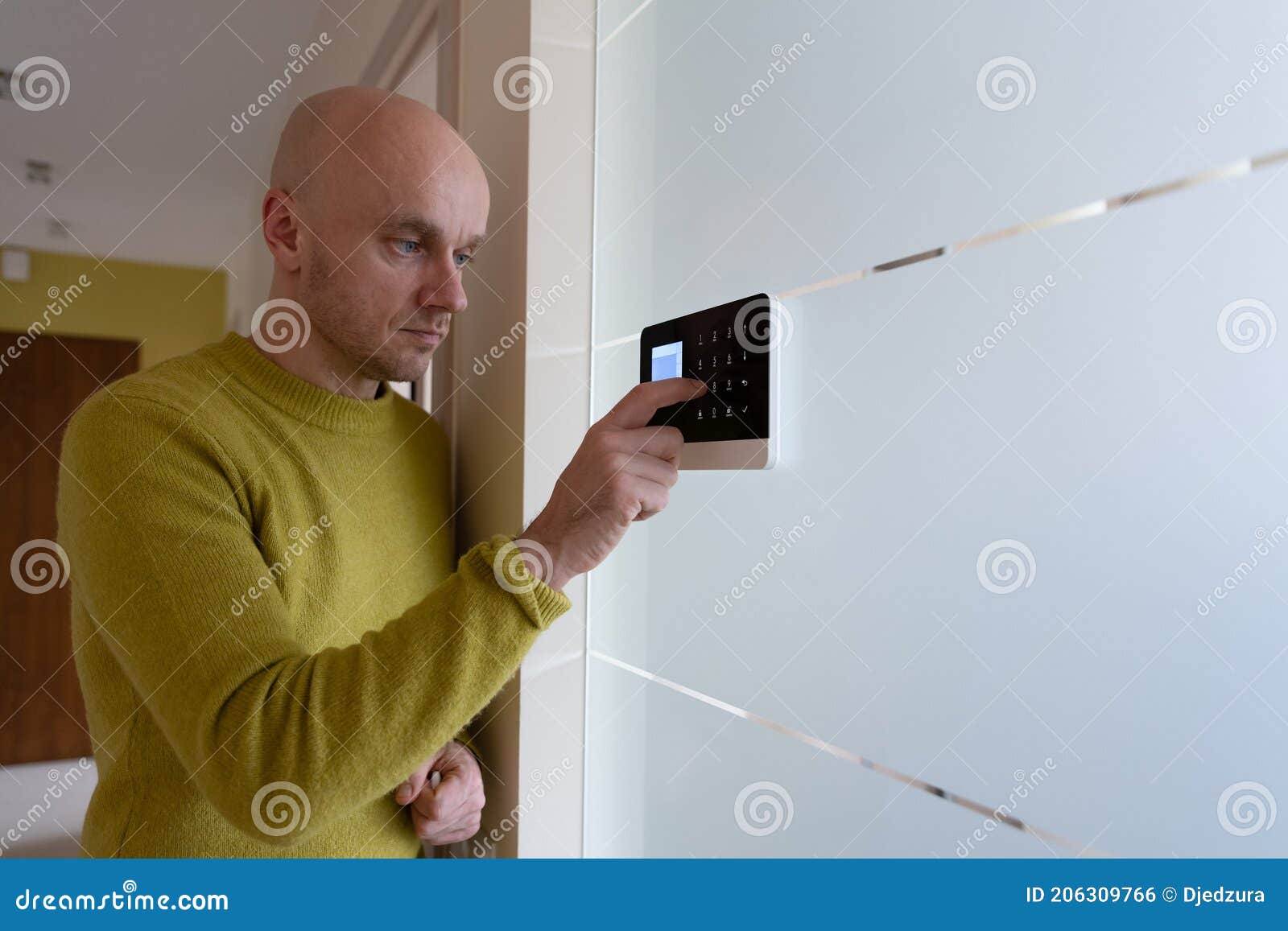 A Handsome Man Sounds the Alarm before he Leaves the House.System ...