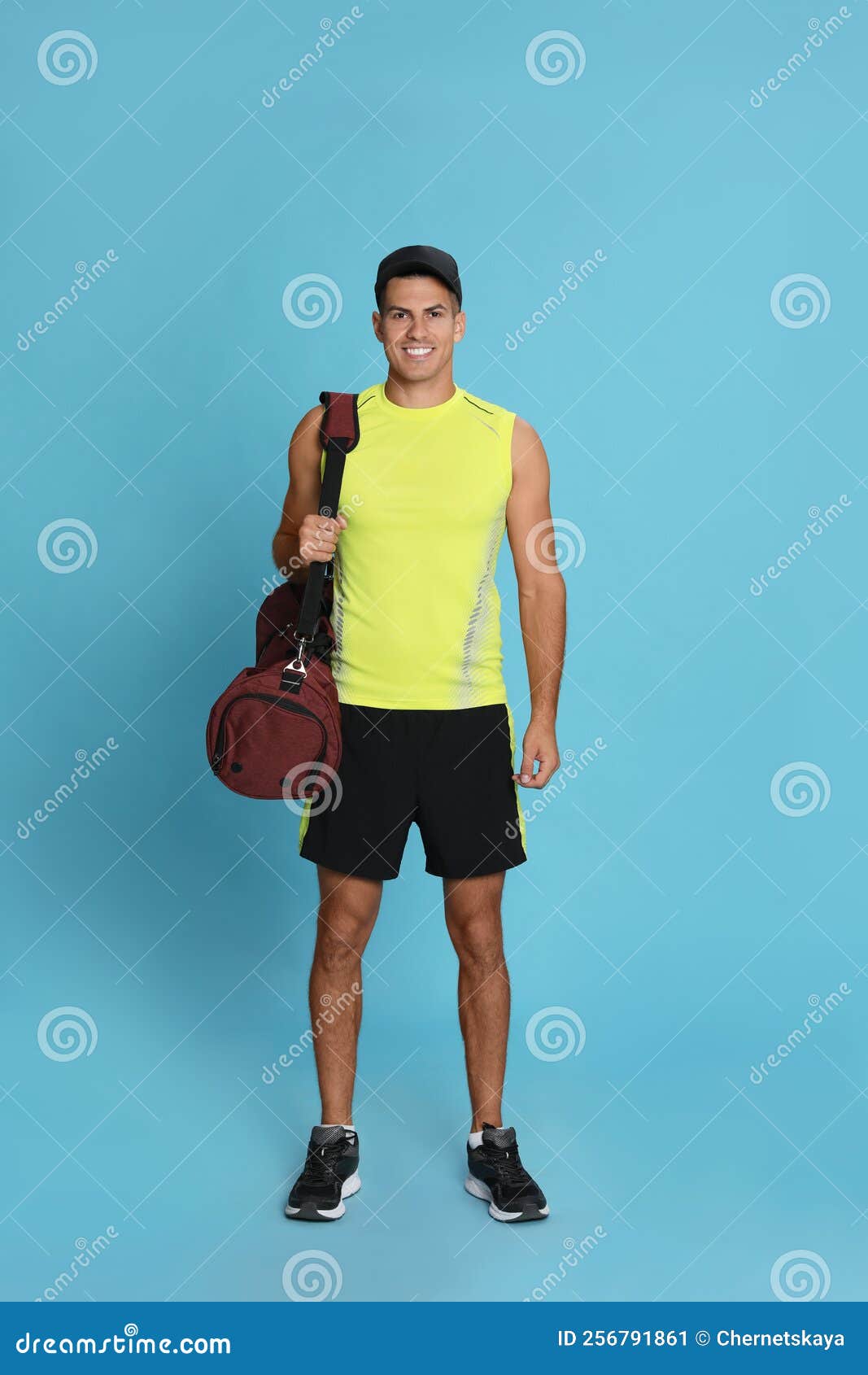Handsome Man with Sports Bag on Light Blue Background Stock Image ...