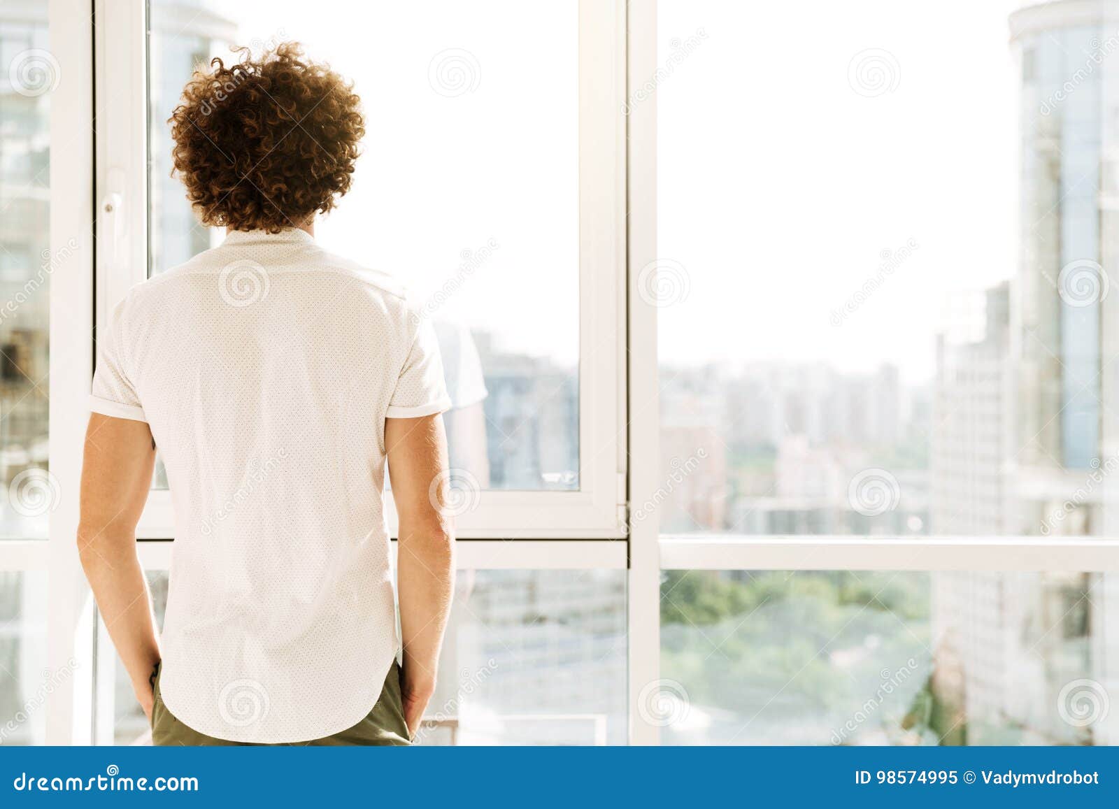 Handsome Man Standing Near Window Indoors. Stock Image - Image of ...