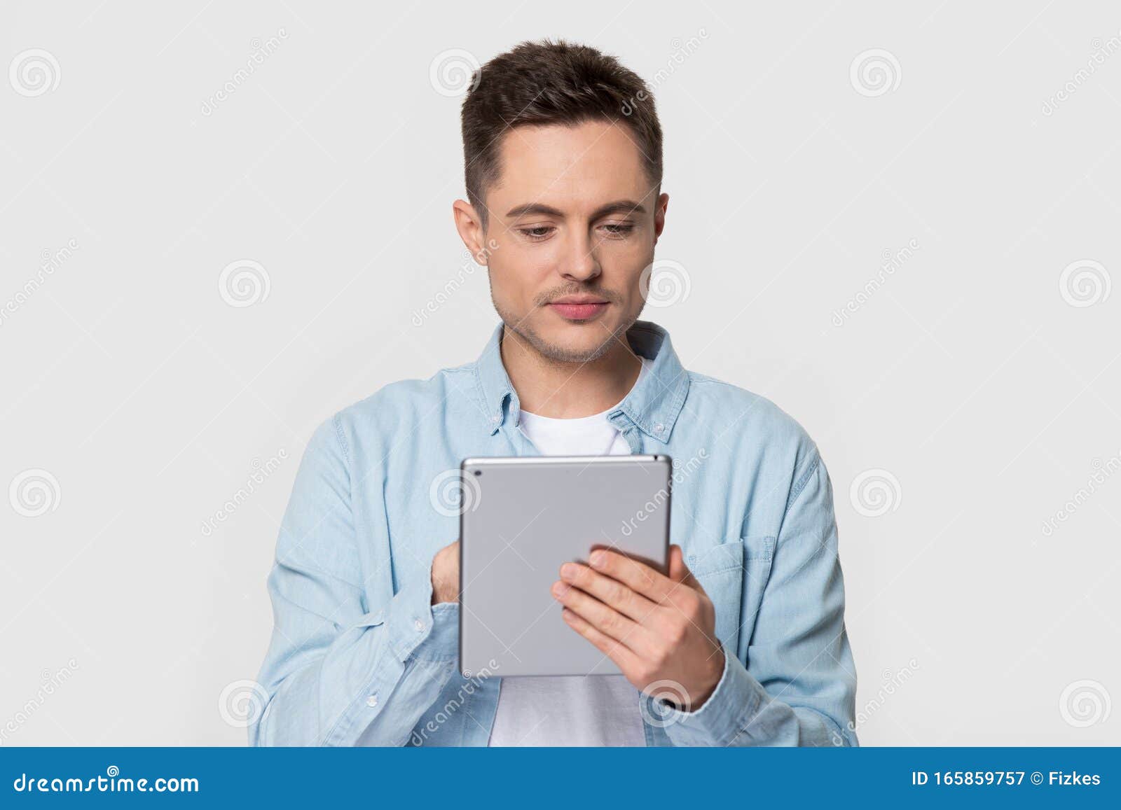 Handsome Man Standing Scrolling and Typing on Electronic Tablet Device ...