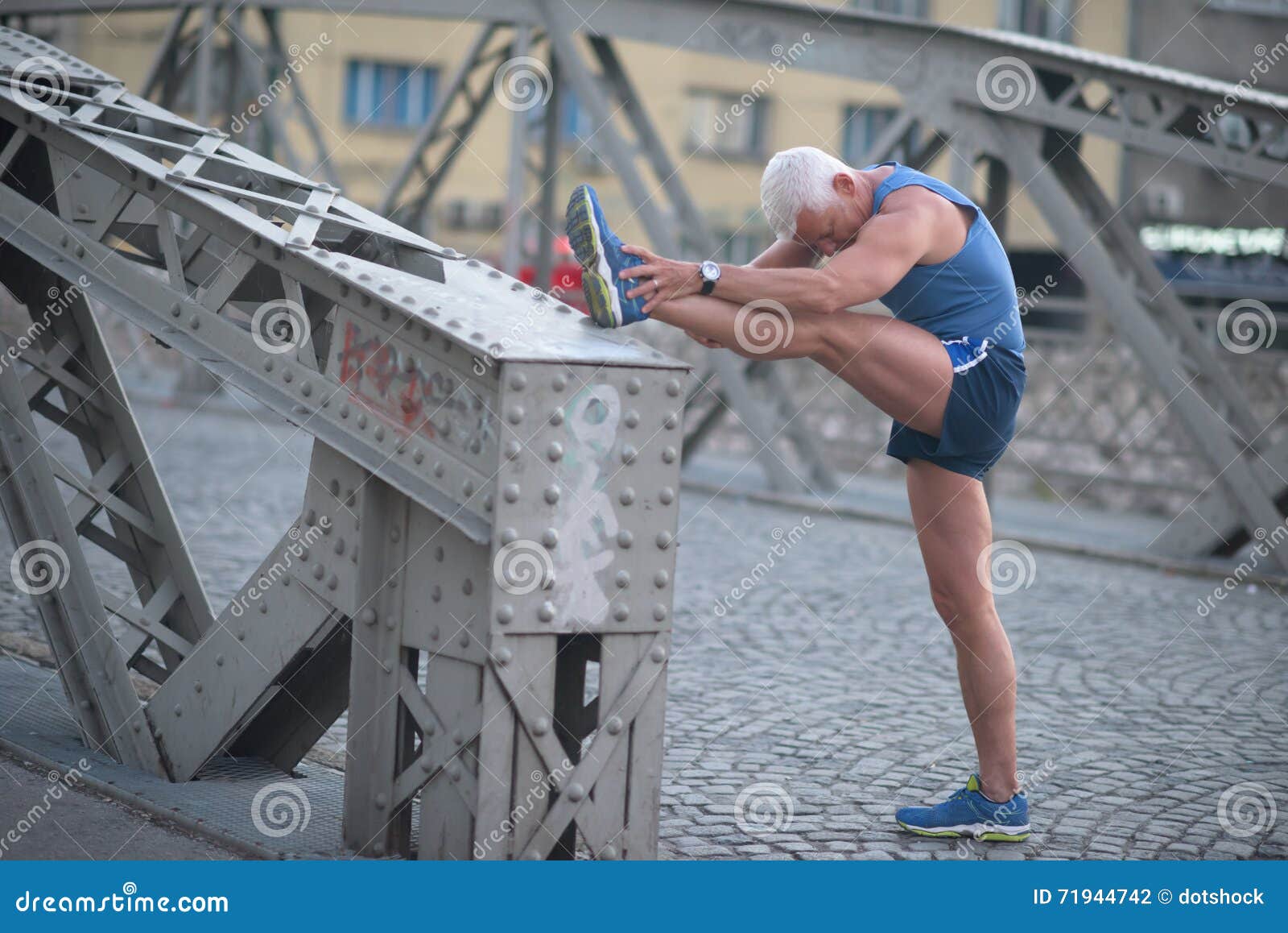 Handsome Man Stretching before Jogging Stock Photo - Image of body ...