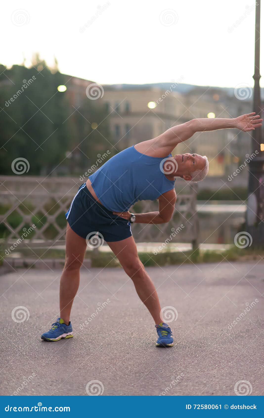 Handsome Man Stretching before Jogging Stock Image - Image of person ...