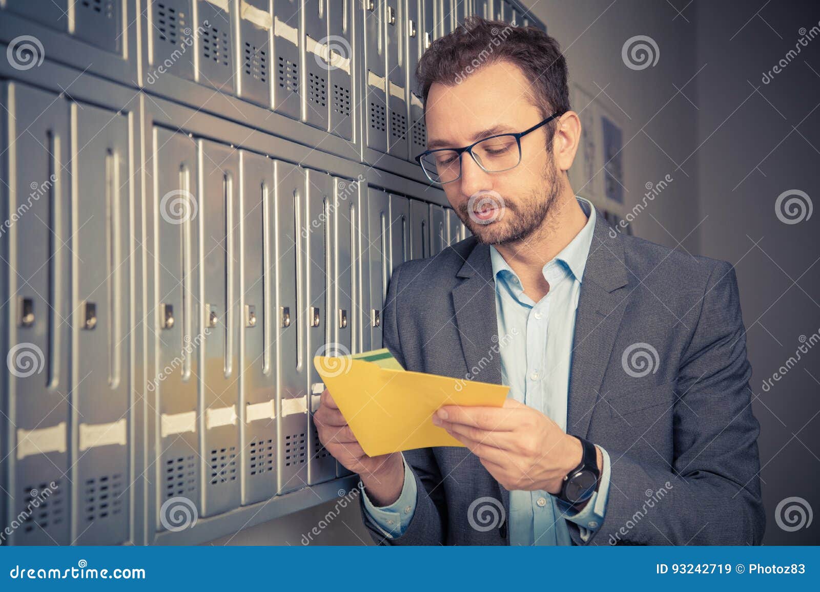 Handsome Man in Suit Checking Mail Next To the Mailboxes Stock Image ...