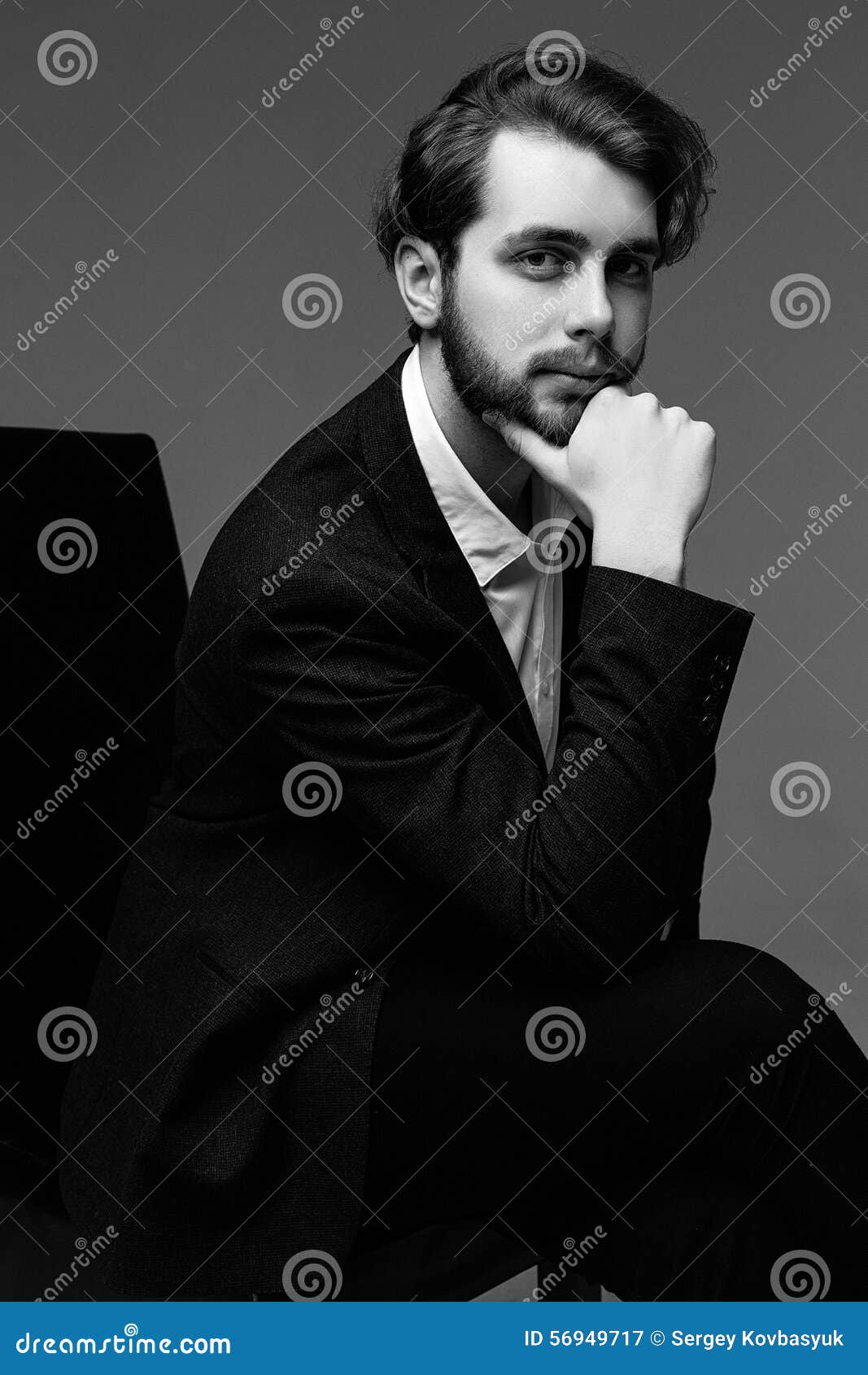 Handsome man in suit stock image. Image of chair, jacket - 56949717
