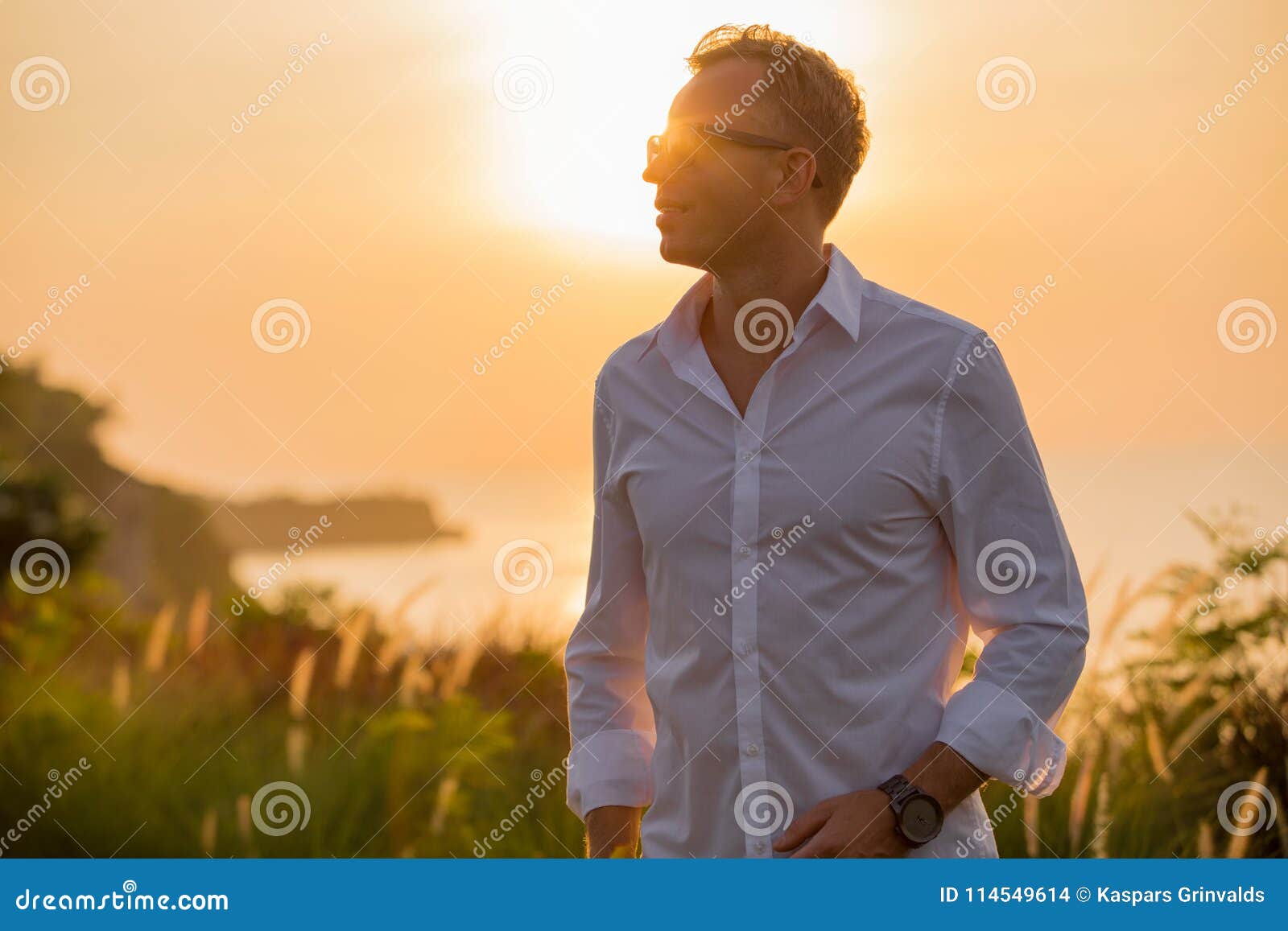 Handsome man at sunset stock photo. Image of shirt, single - 114549614