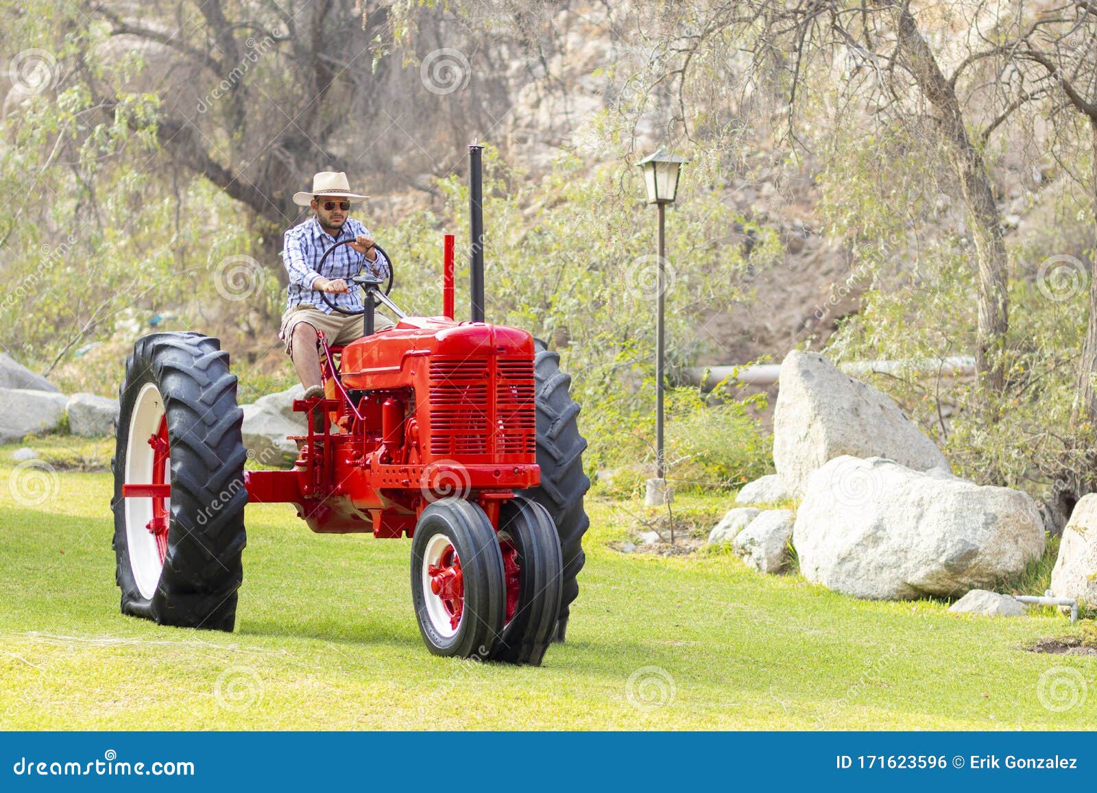 Handsome Man with Sunglasses Driving the Tractor To Work Stock Photo ...
