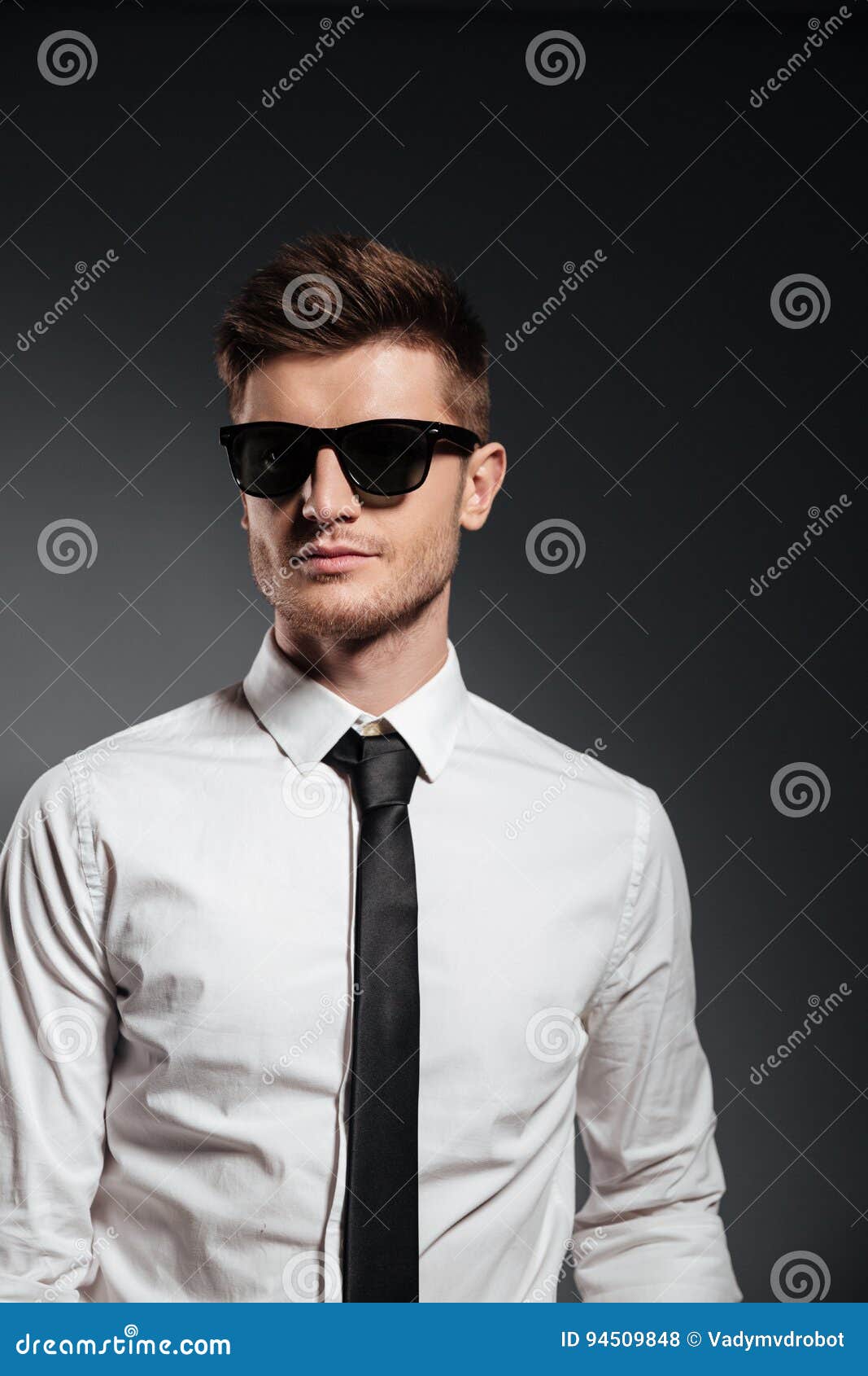 Handsome Man In Sunglasses And Formalwear Posing And Looking Away Stock