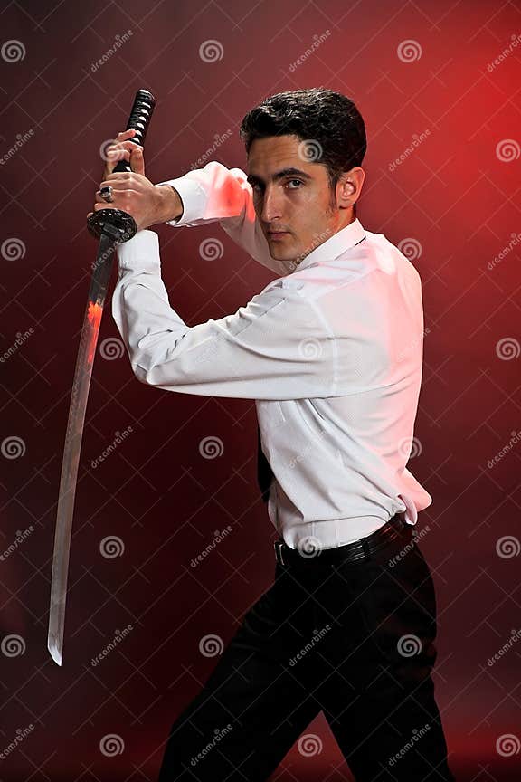 Handsome man with sword. stock photo. Image of unshaven - 23804968