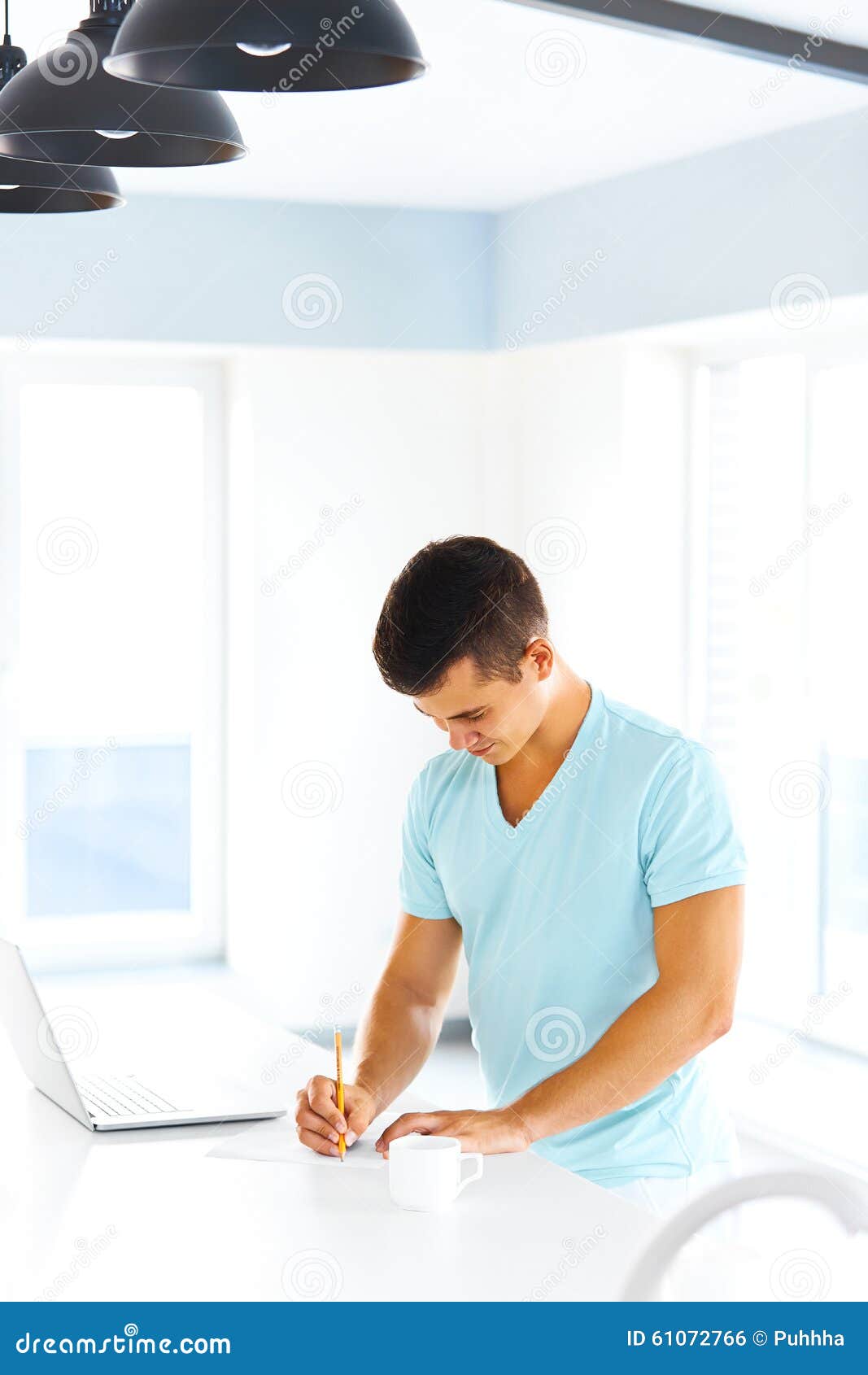 Handsome man taking notes. stock photo. Image of cheerful - 61072766