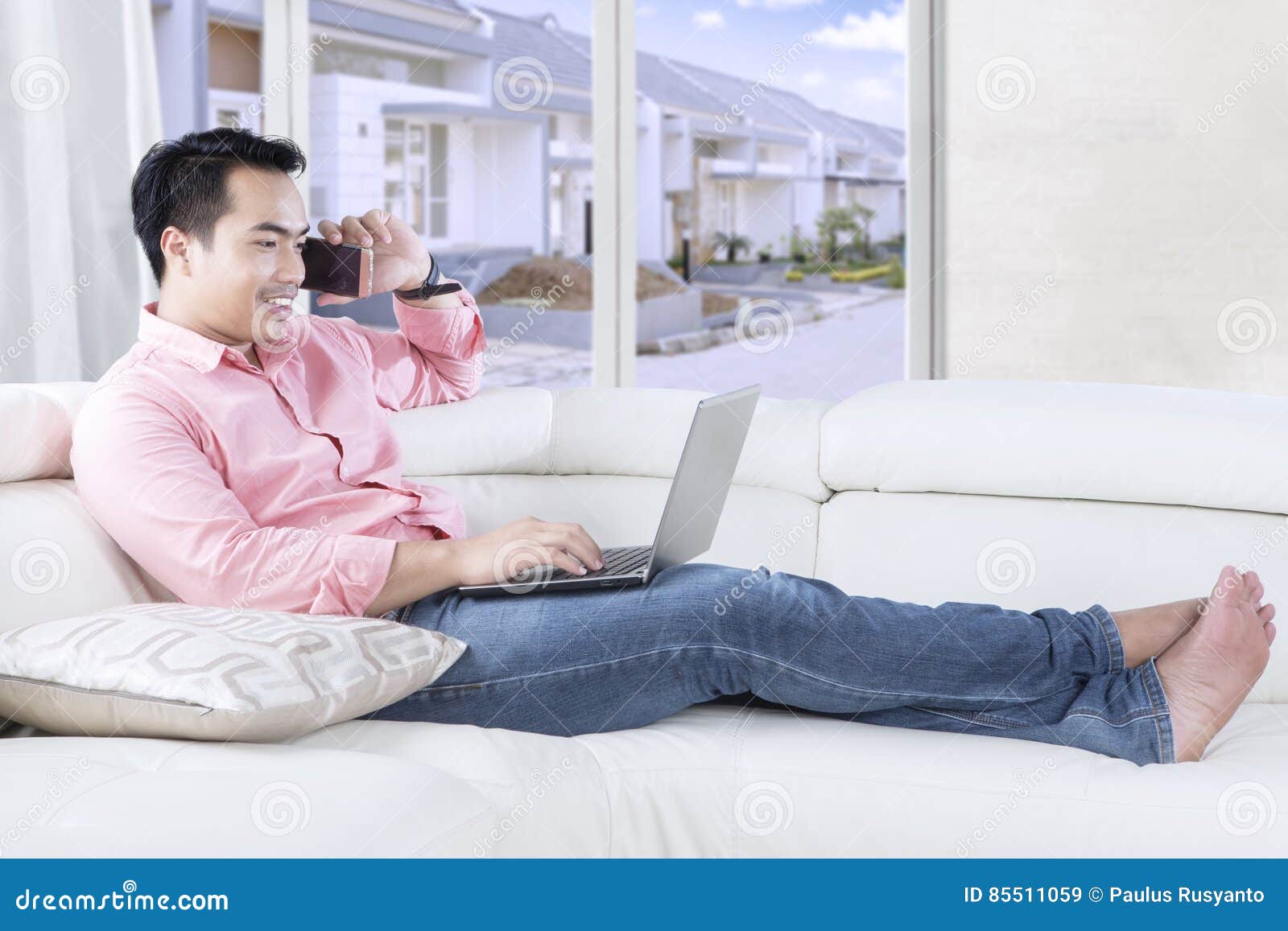 Handsome Man Talks on Cellphone at Couch Stock Image - Image of couch ...